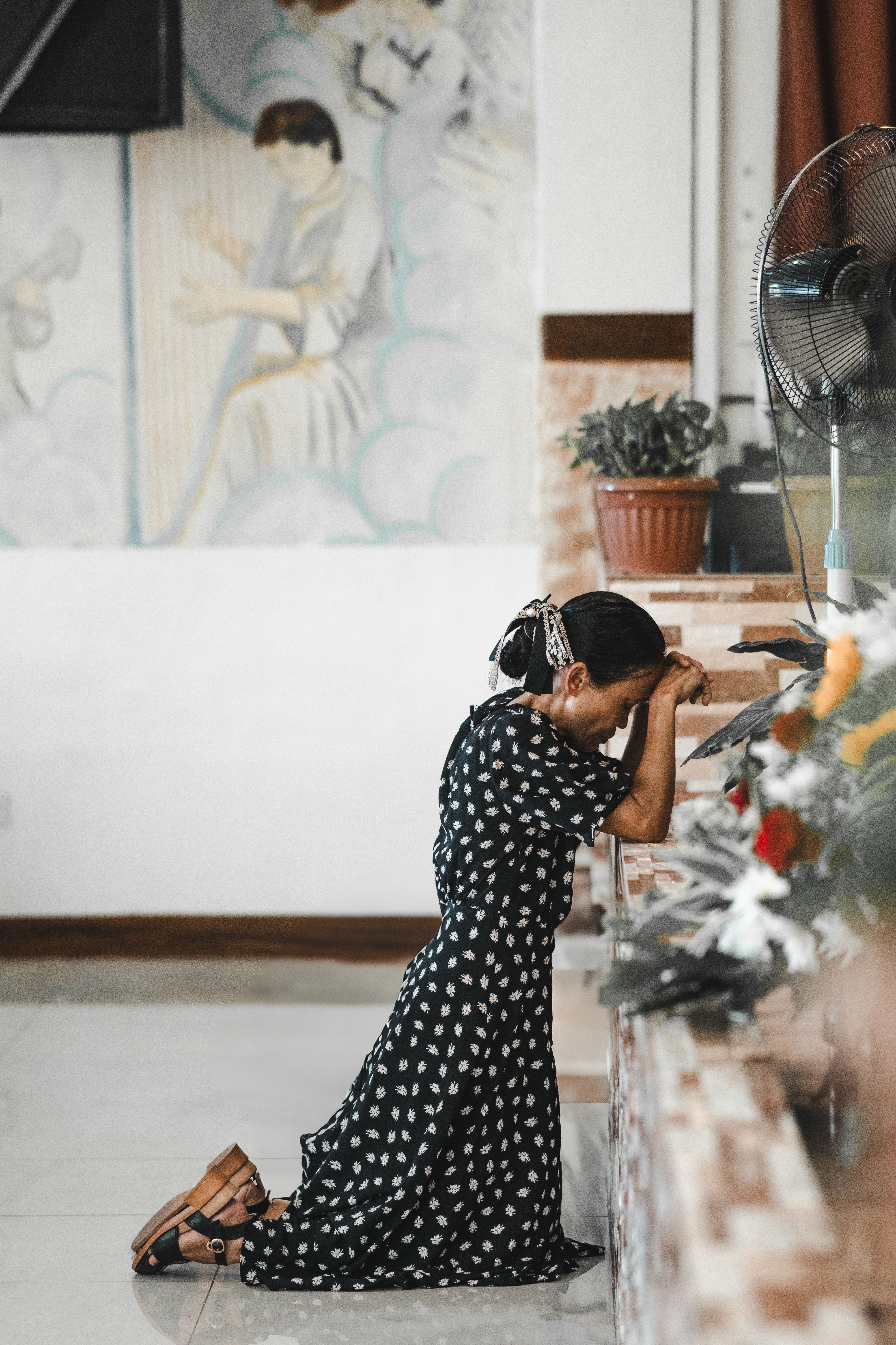 Woman Praying in a Church by the Altar · Free Stock Photo