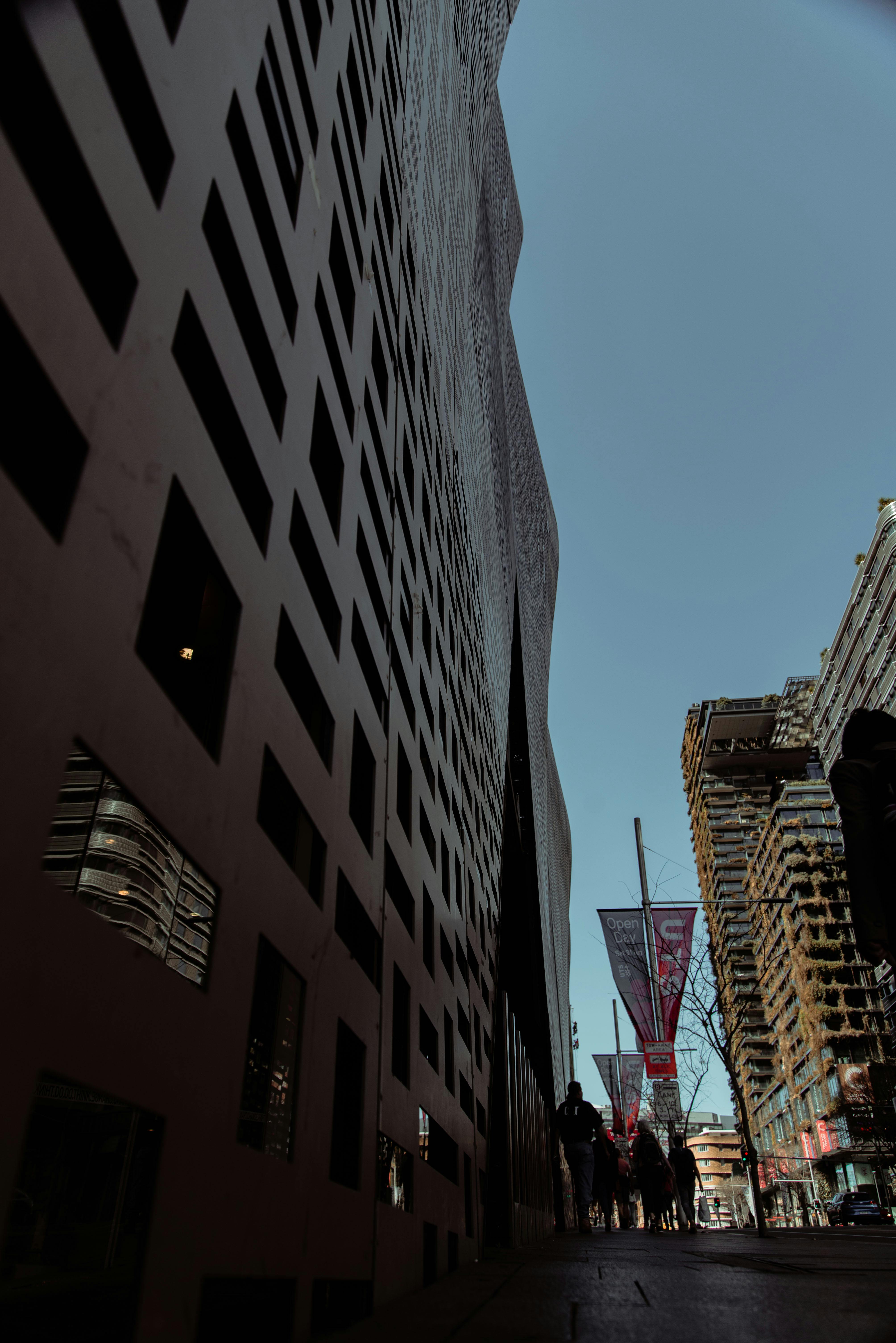 People Walking Beside Building · Free Stock Photo