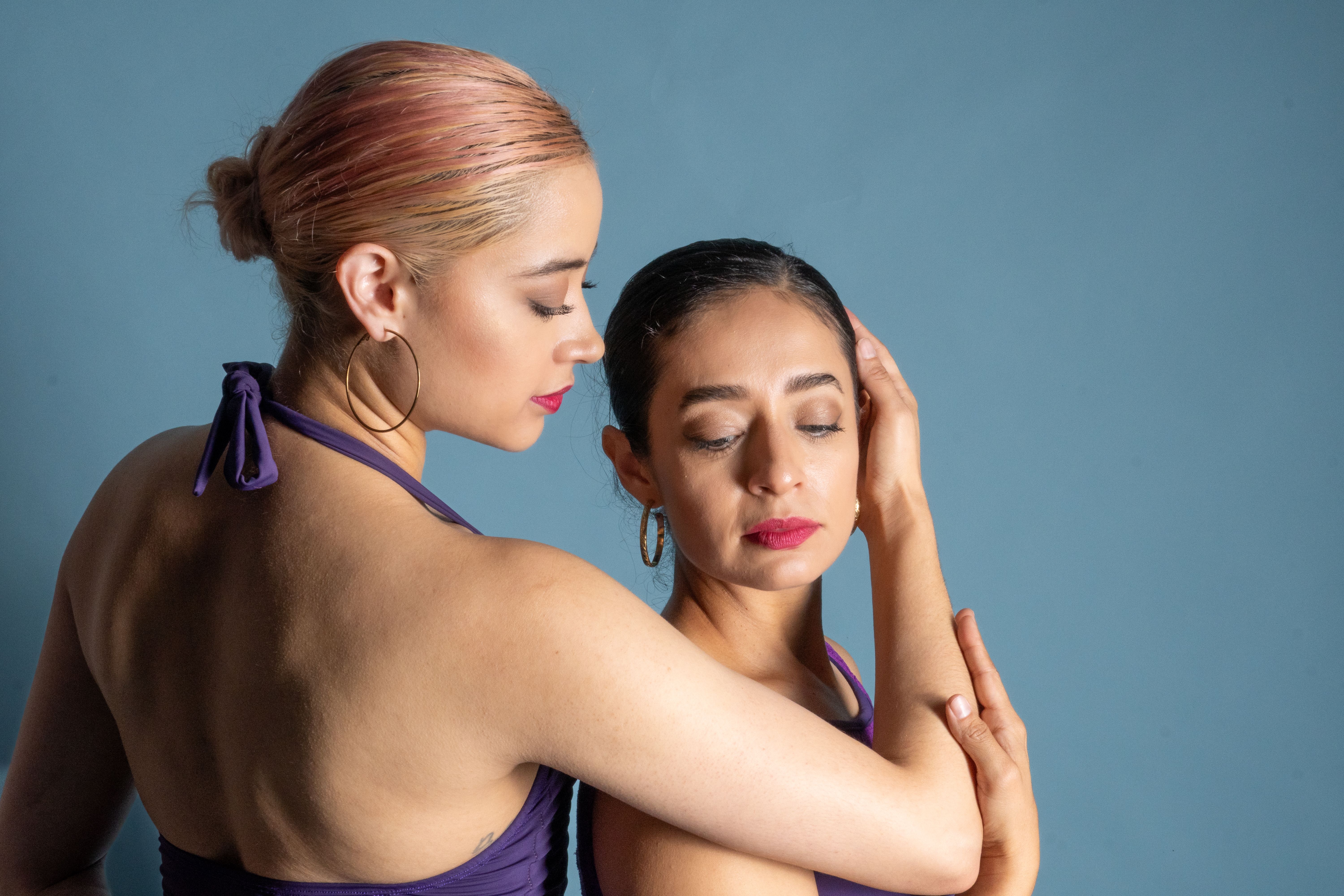 Elegant Portrait of Two Female Dancers Embracing · Free Stock Photo