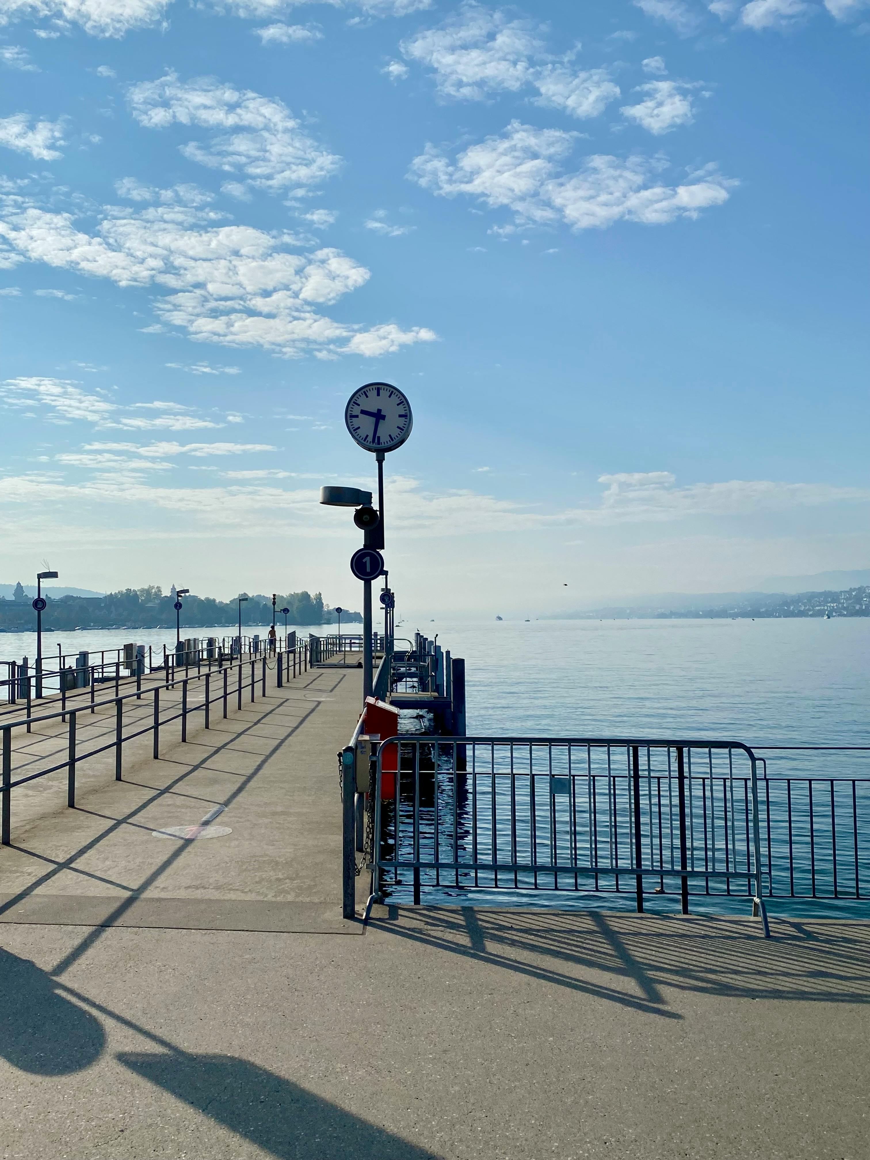 Scenic Zurich Lakeside Pier under Blue Sky · Free Stock Photo
