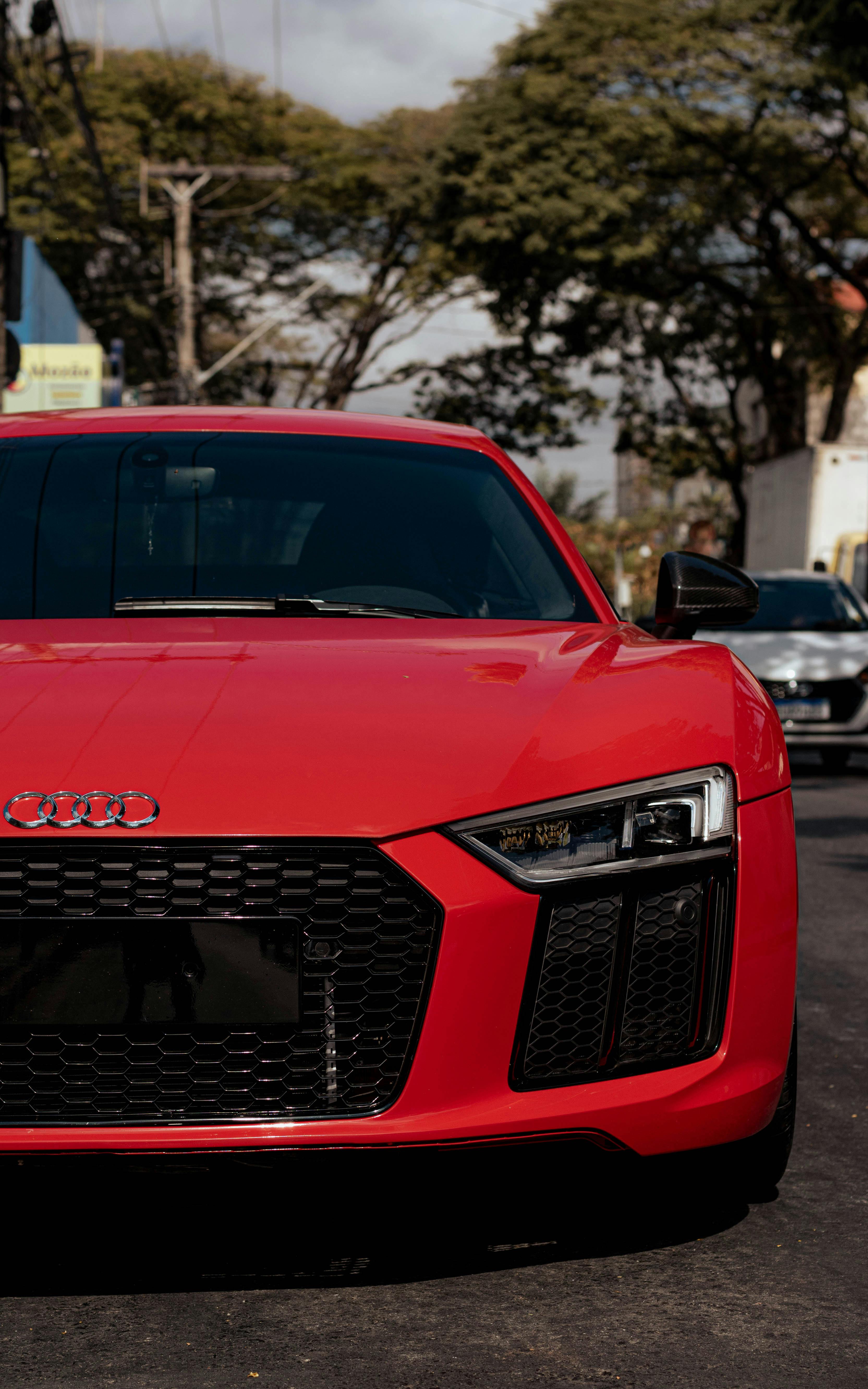 Red Sports Car on City Street in Daylight · Free Stock Photo