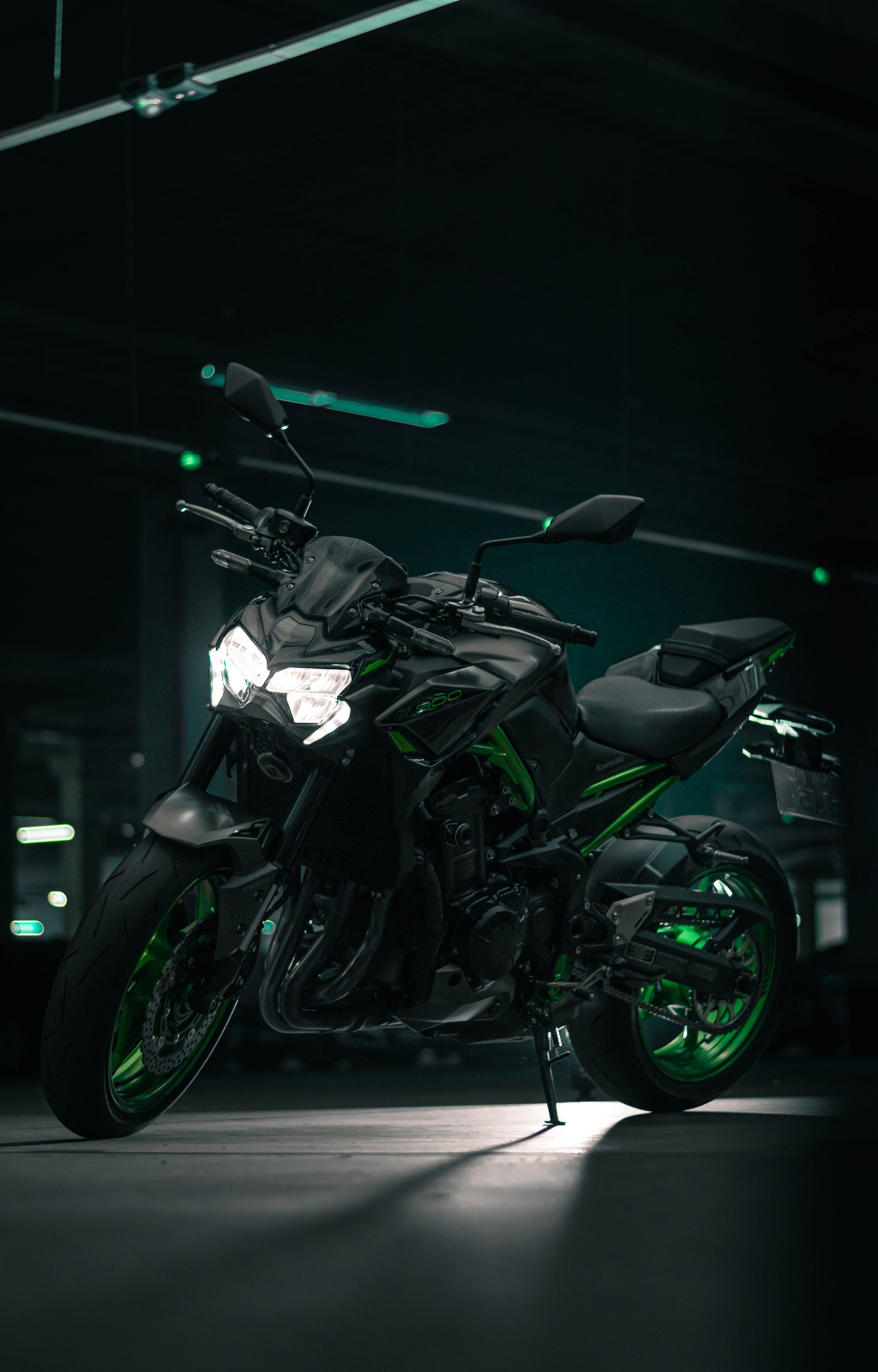 Dynamic Black and Green Motorcycle in Urban Setting · Free Stock Photo