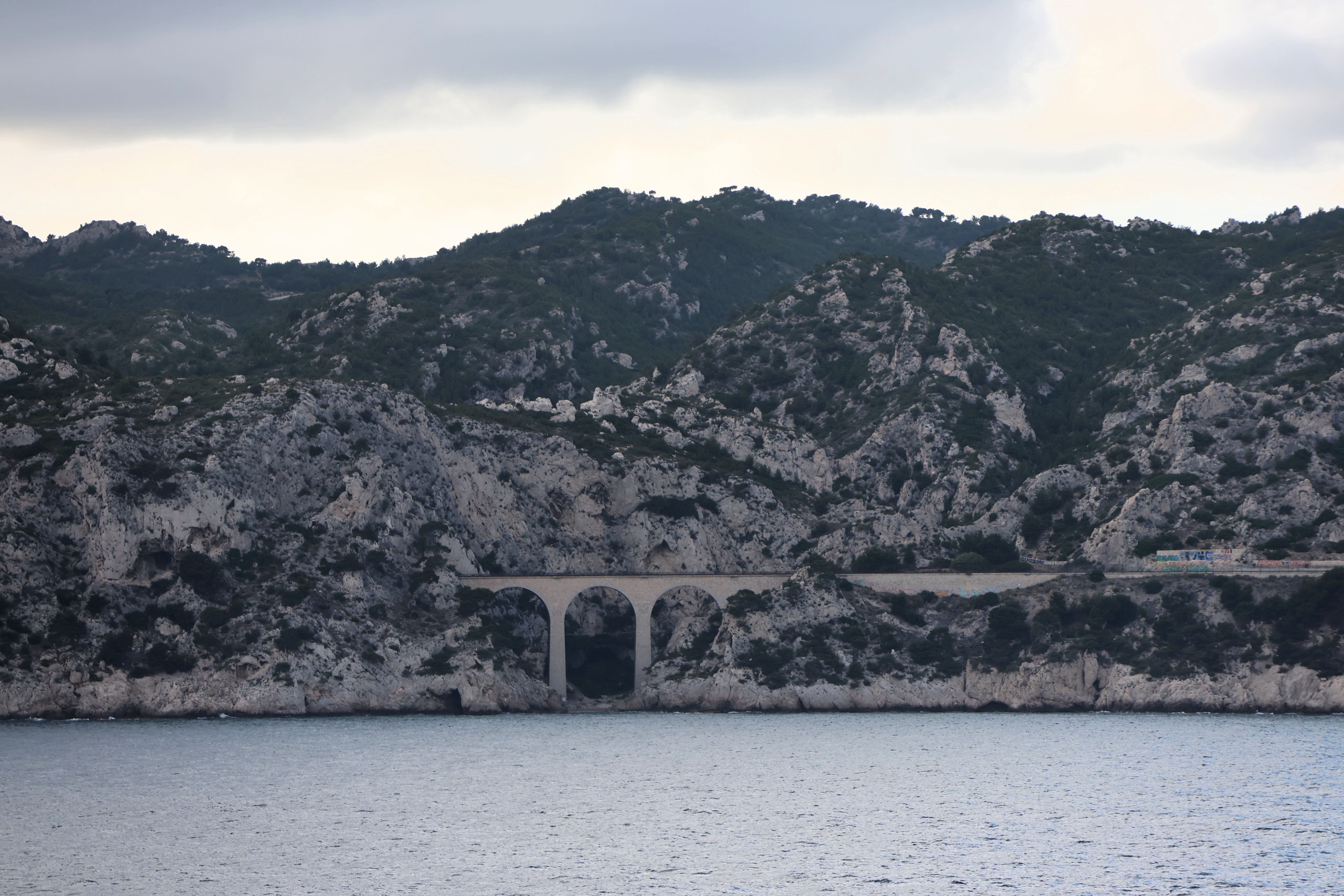 Scenic View of Coastal Mountain Landscape with Bridge · Free Stock Photo