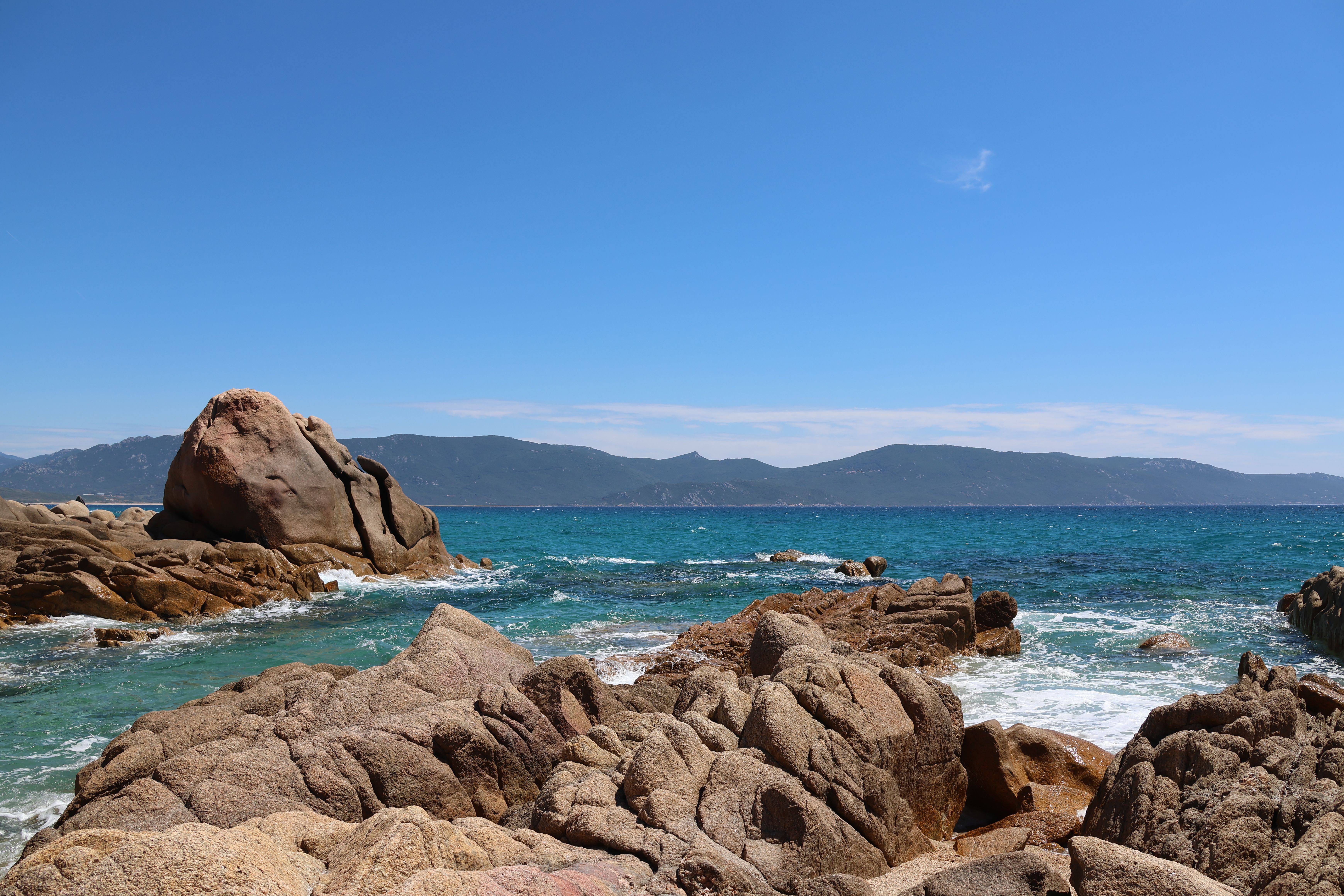 Scenic Rocky Beach with Blue Ocean Waves · Free Stock Photo