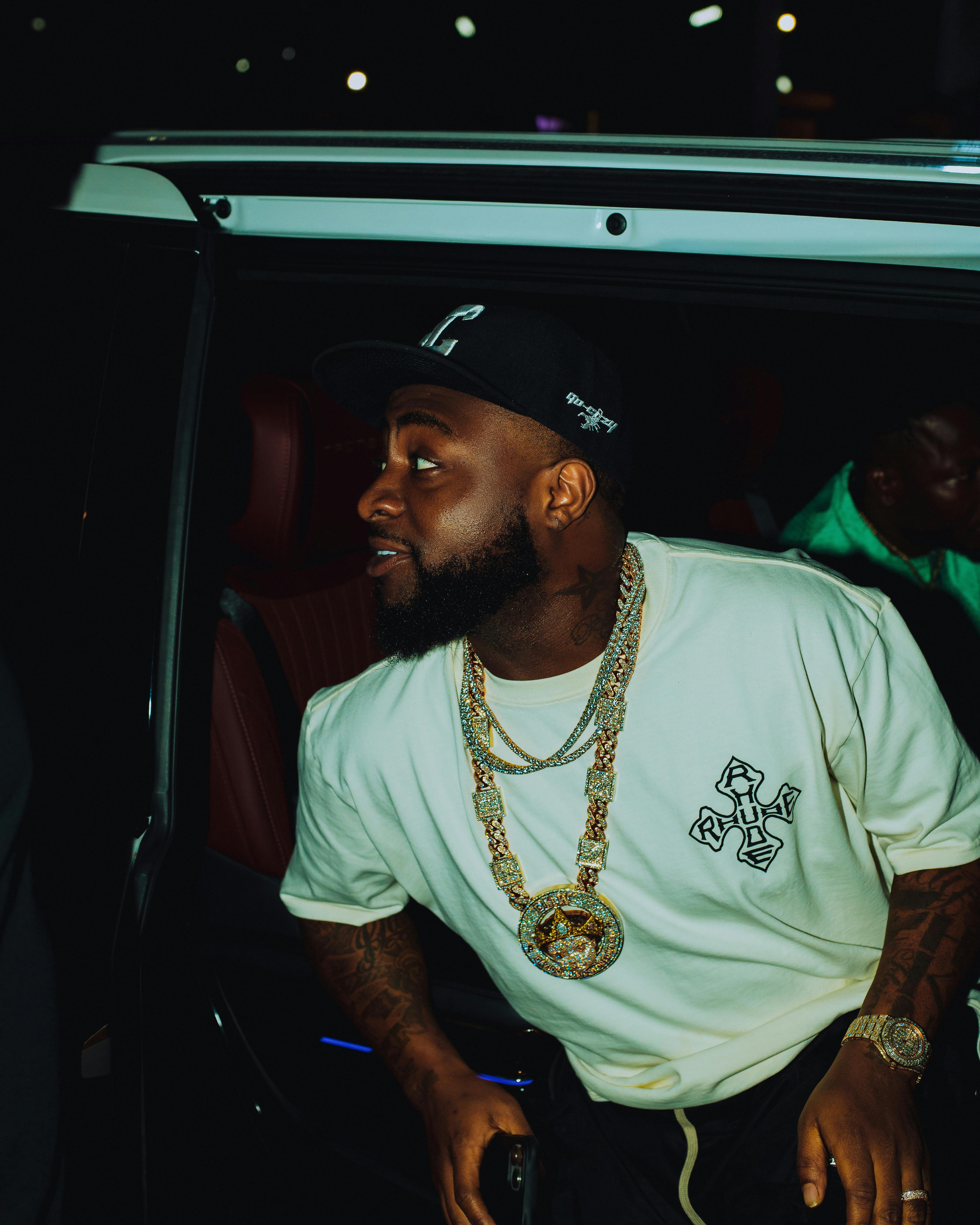 Man Exiting Car at Night in Urban Setting · Free Stock Photo