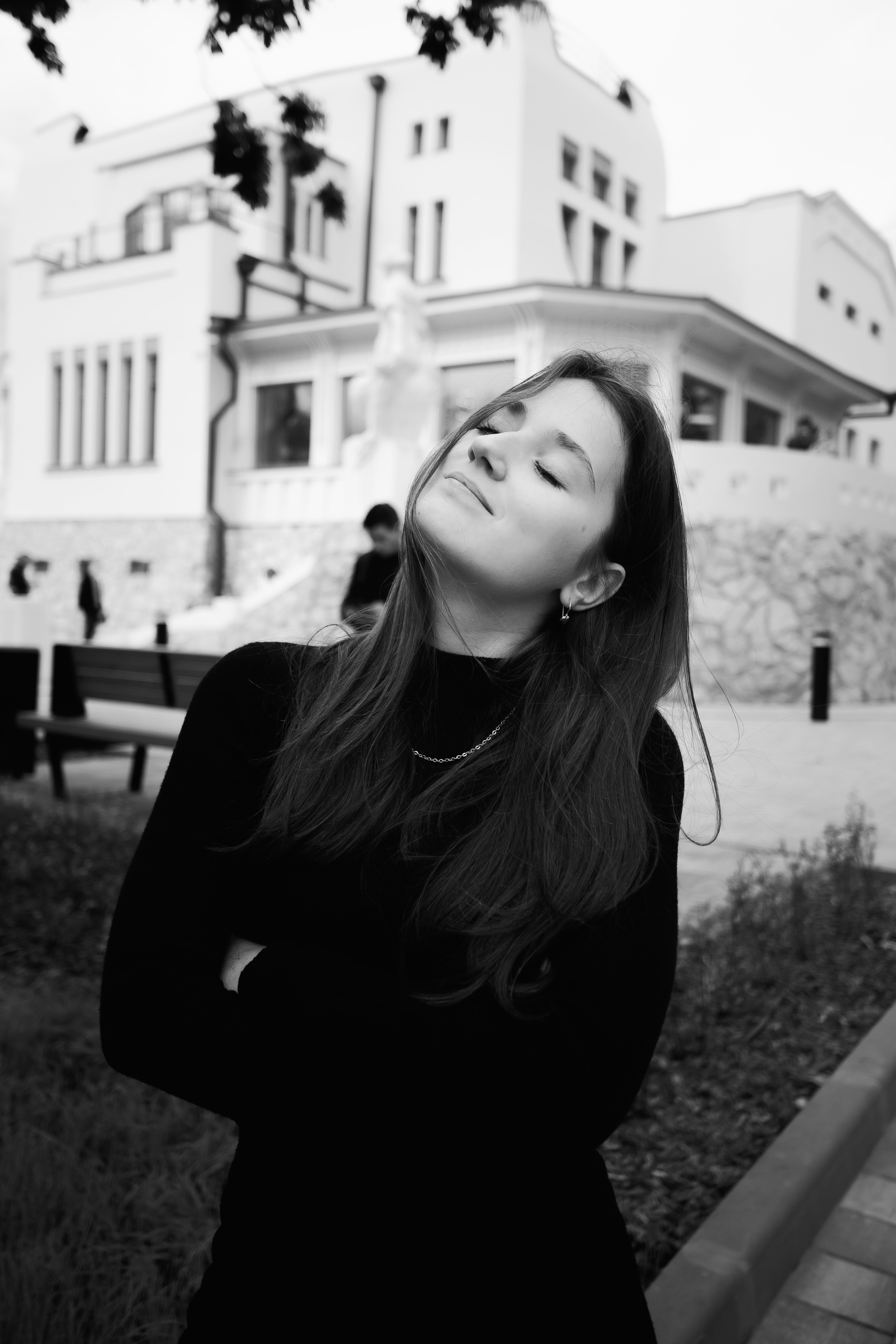 Monochrome Portrait of a Relaxed Woman Outdoors · Free Stock Photo