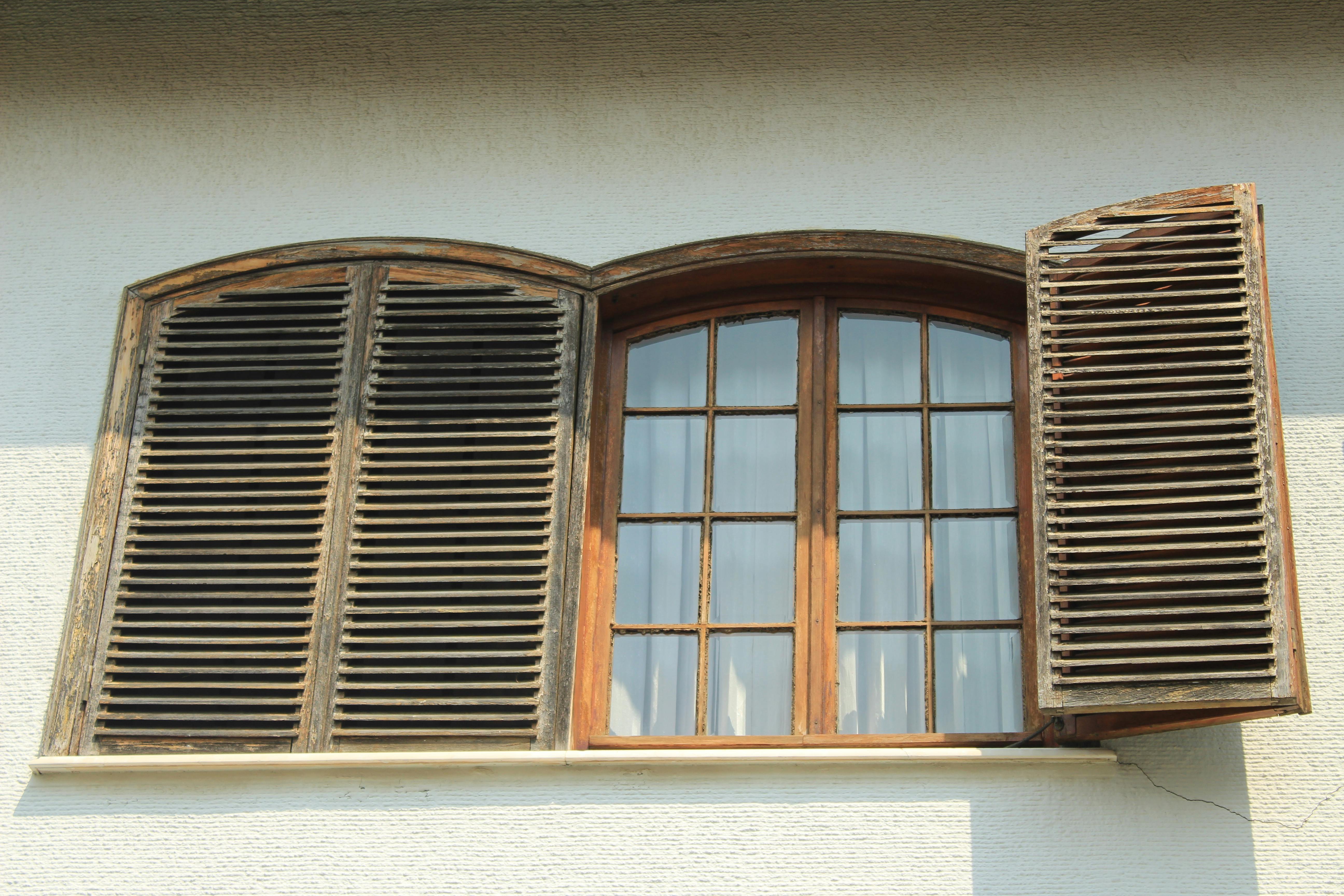 Rustic Arched Wooden Window with Open Shutters · Free Stock Photo