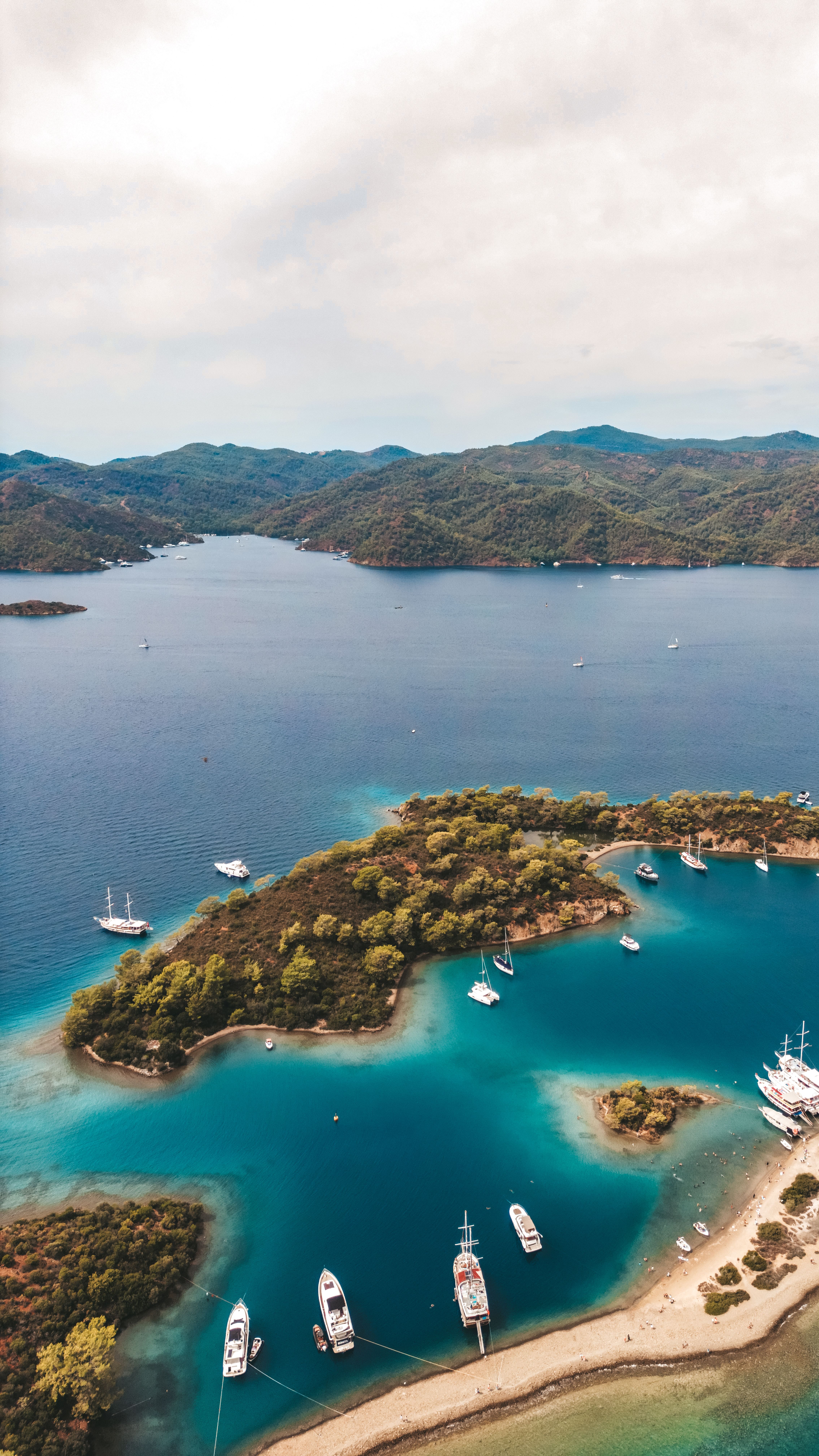 Aerial View of Turquoise Cove with Sailboats · Free Stock Photo