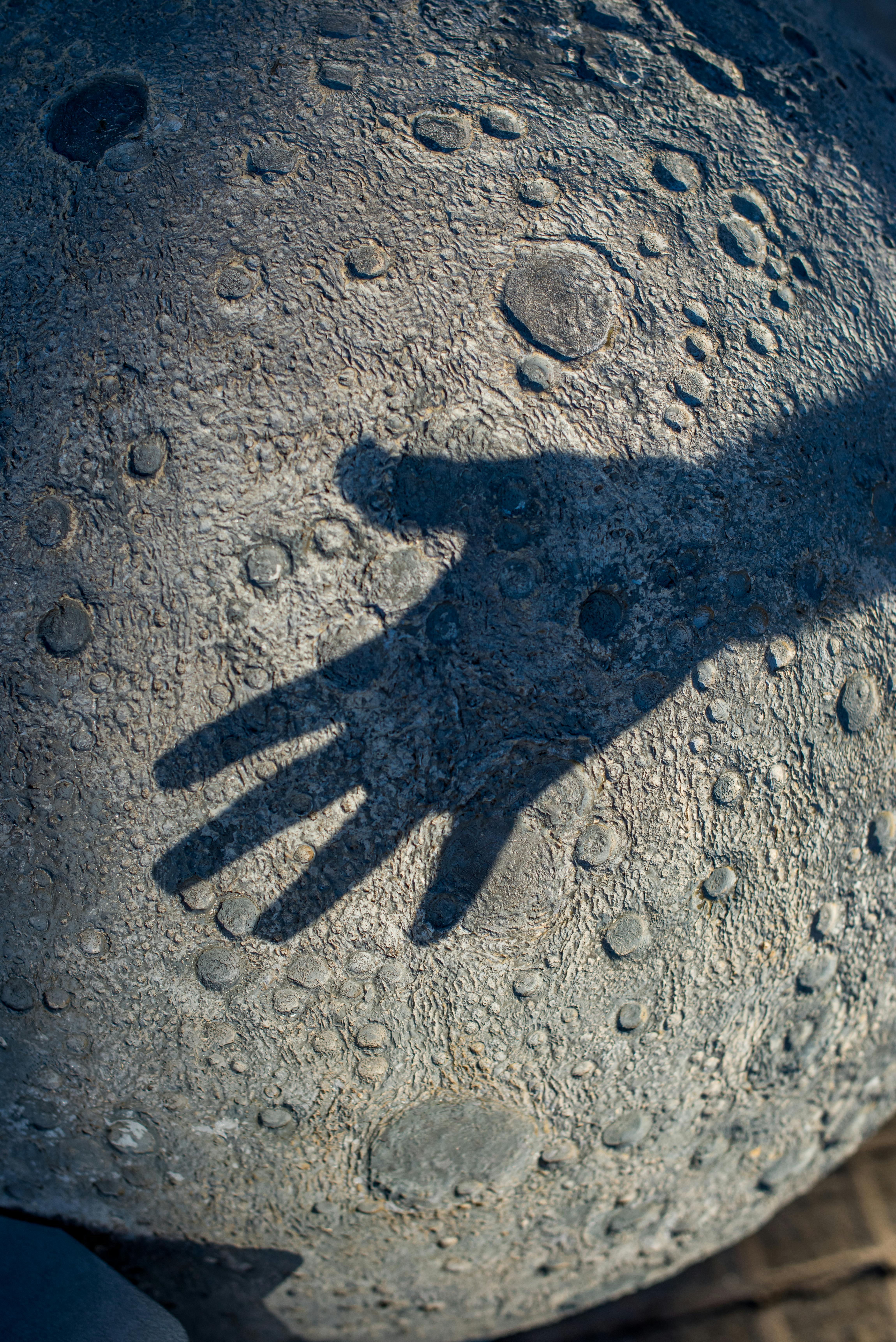 Shadow on Moon-Like Surface with Craters · Free Stock Photo