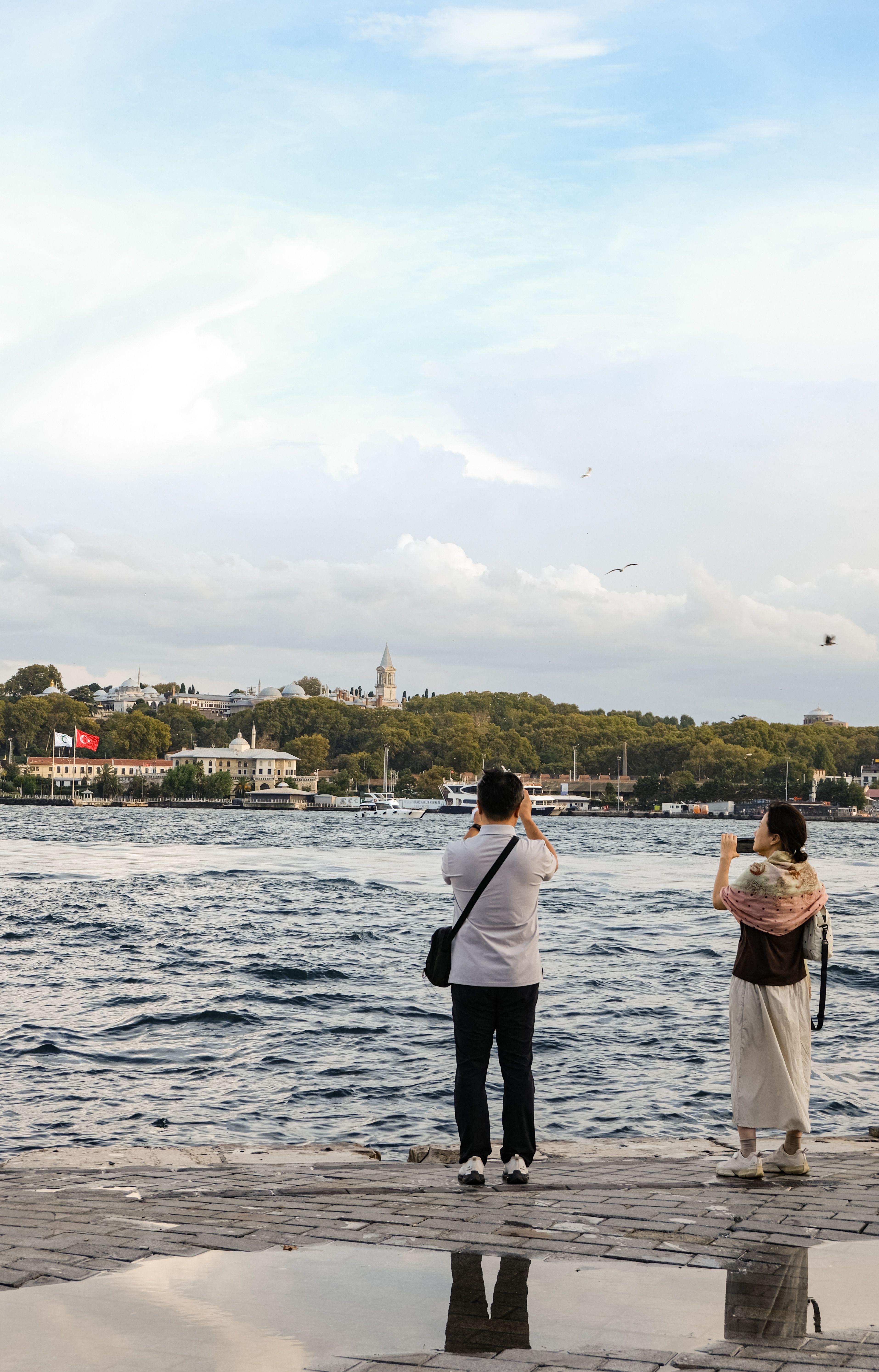 Tourists Enjoying Scenic View of Istanbul Waterfront · Free Stock Photo