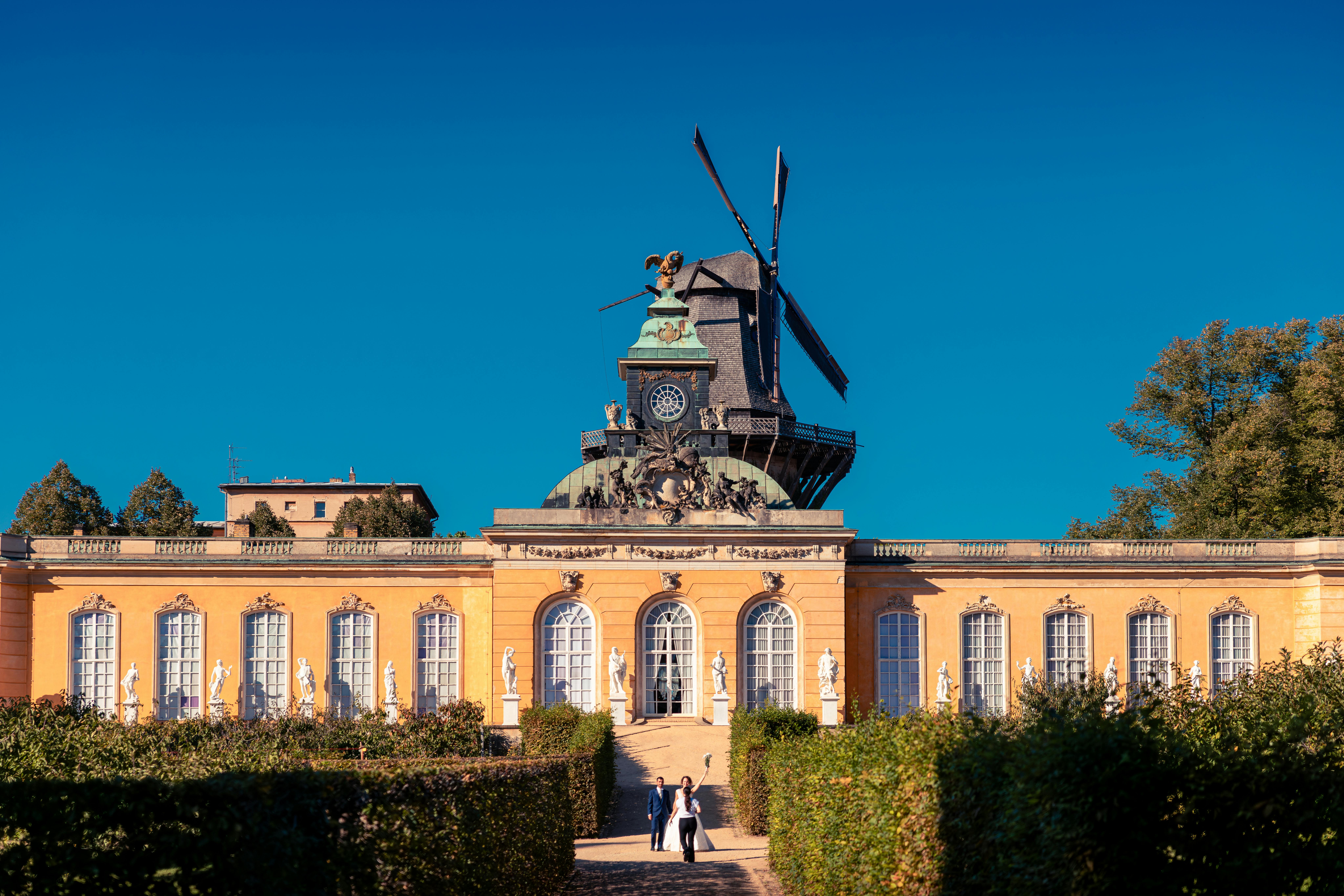 Sanssouci Palace with Historic Windmill in Potsdam · Free Stock Photo