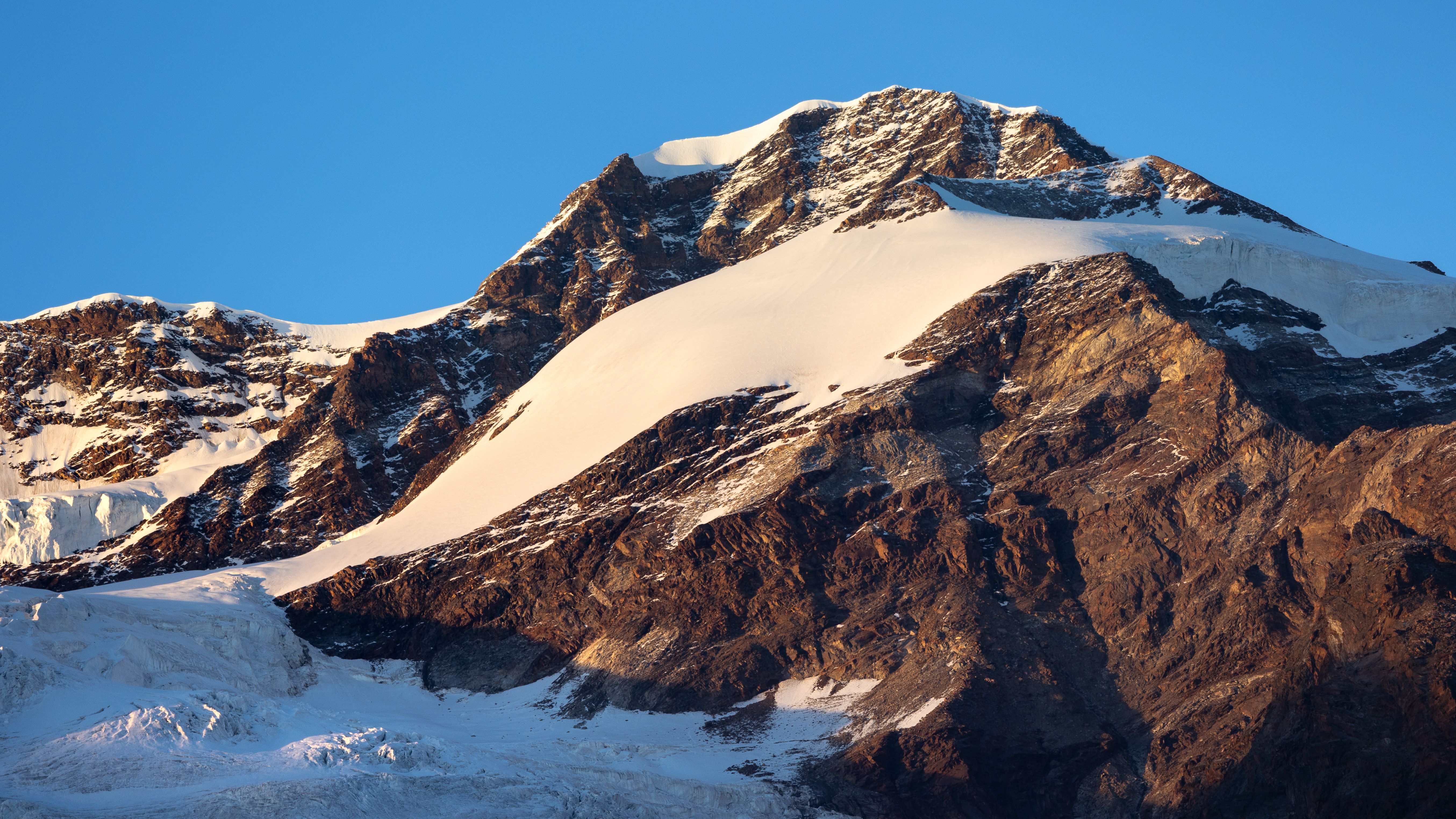 Stunning Snow-Capped Mountain at Sunset · Free Stock Photo