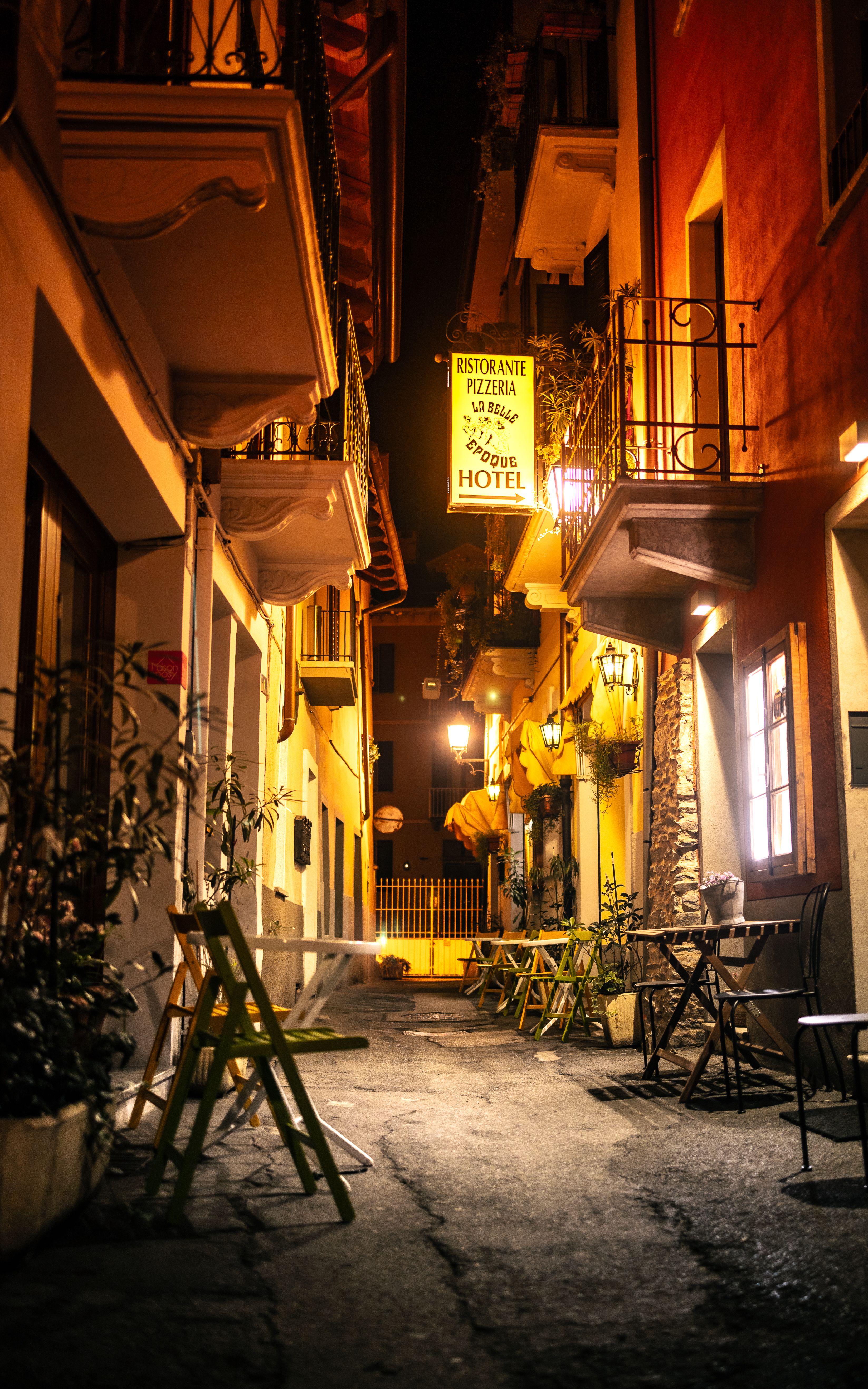 Charming Italian Street at Night with Ambient Lighting · Free Stock Photo