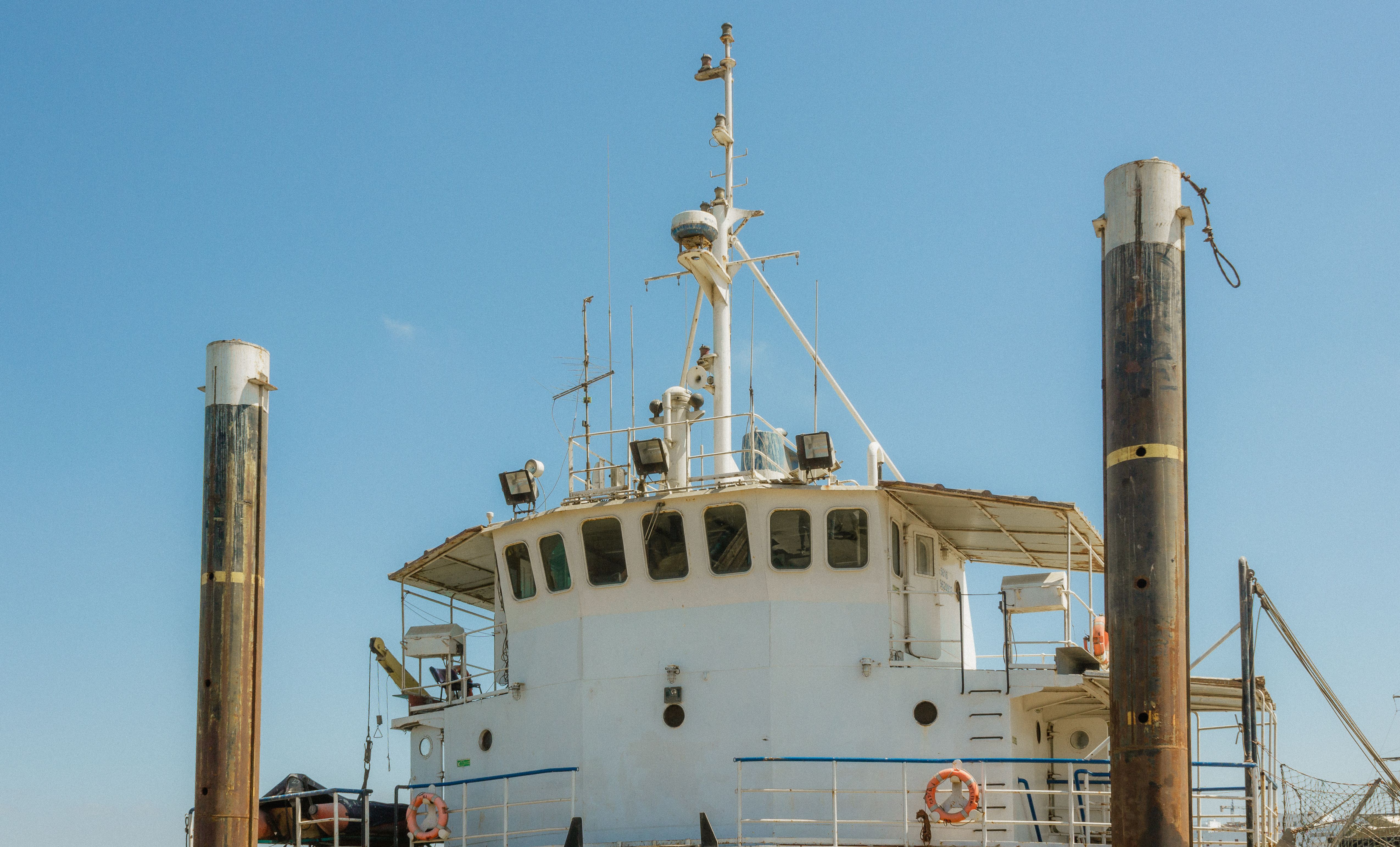 Large Fishing Trawler Docked at Sunny Harbor · Free Stock Photo
