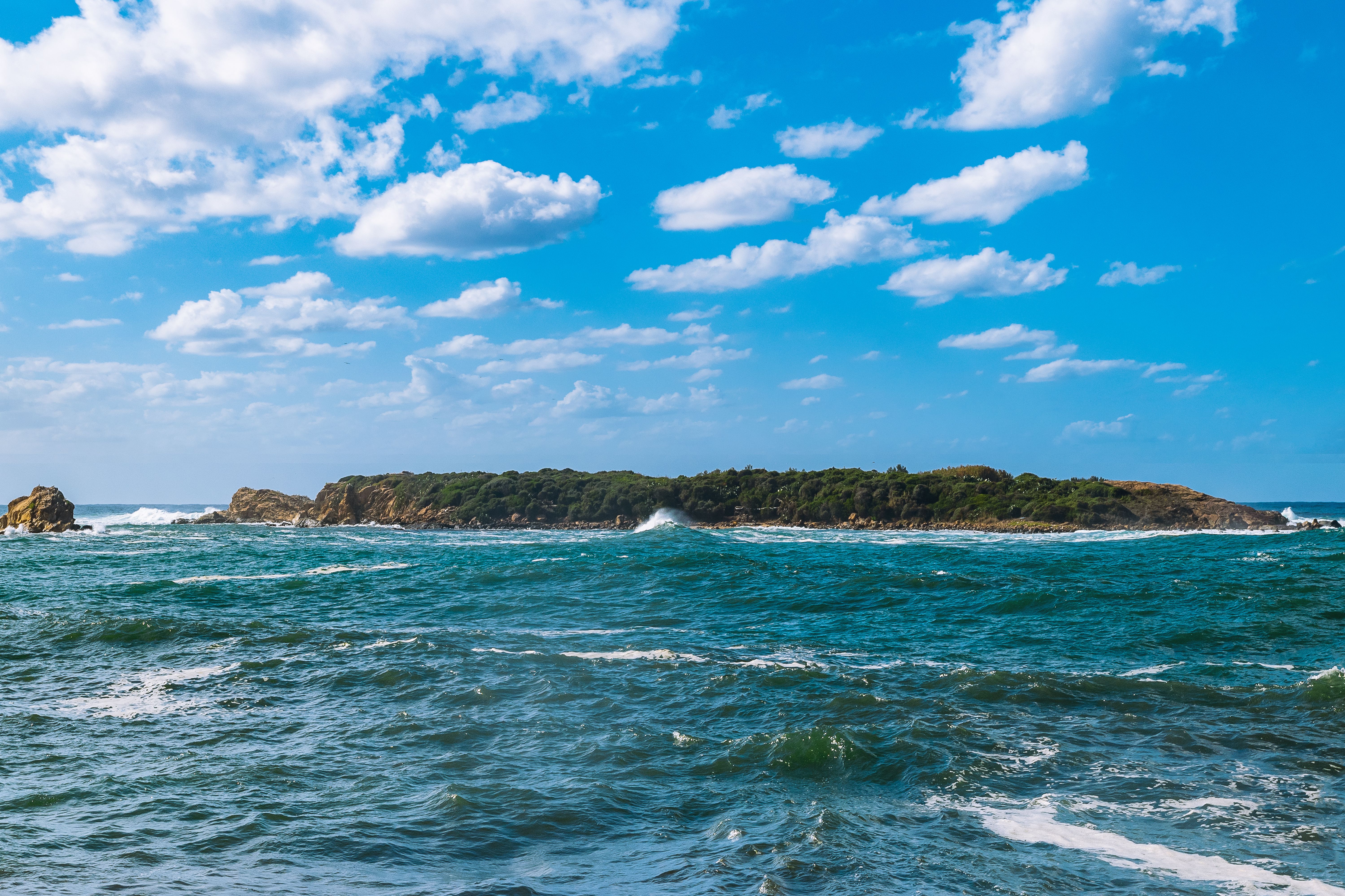 Scenic Ocean View with Island Under Blue Sky · Free Stock Photo