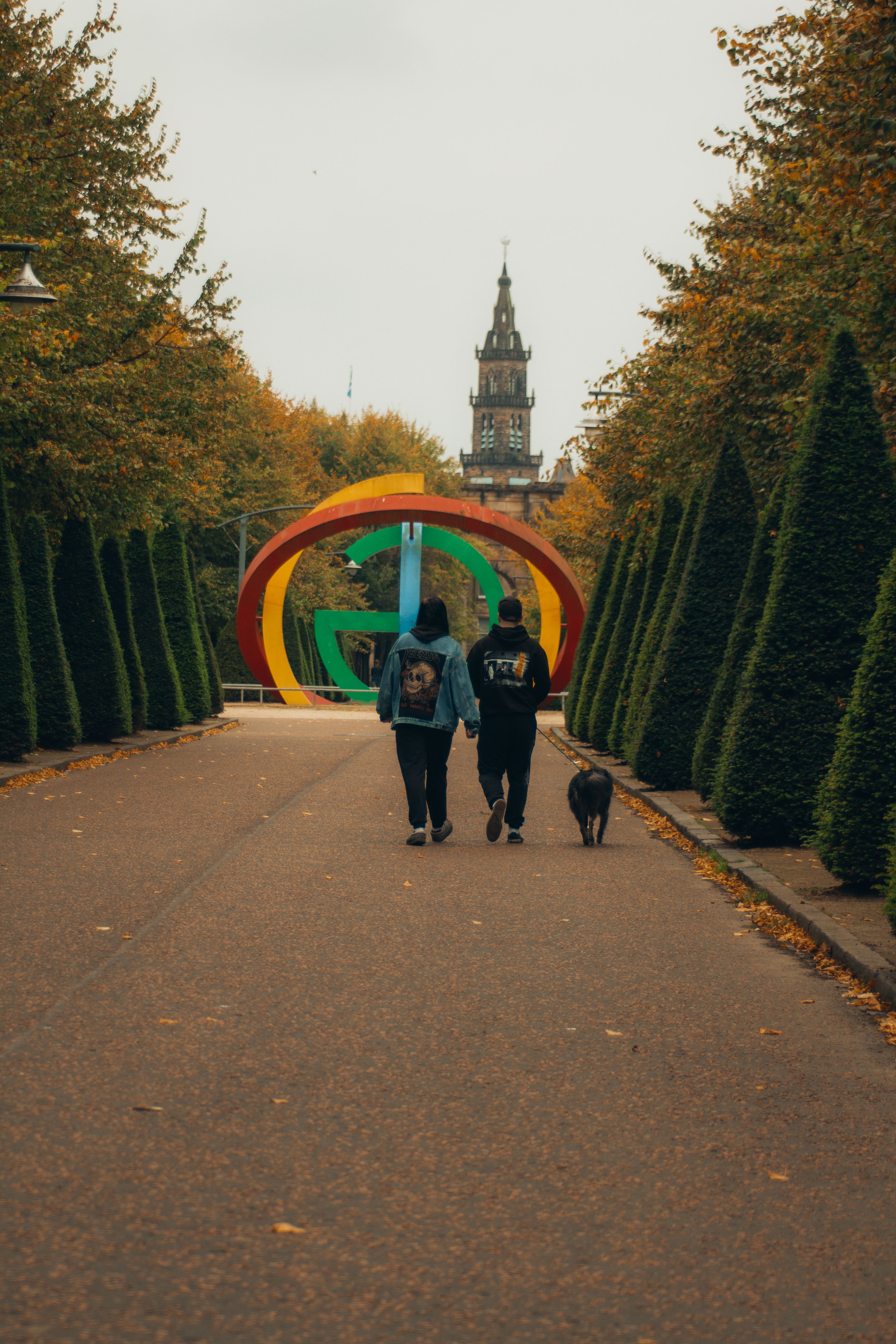 Colorful archway in a tree-lined park path · Free Stock Photo