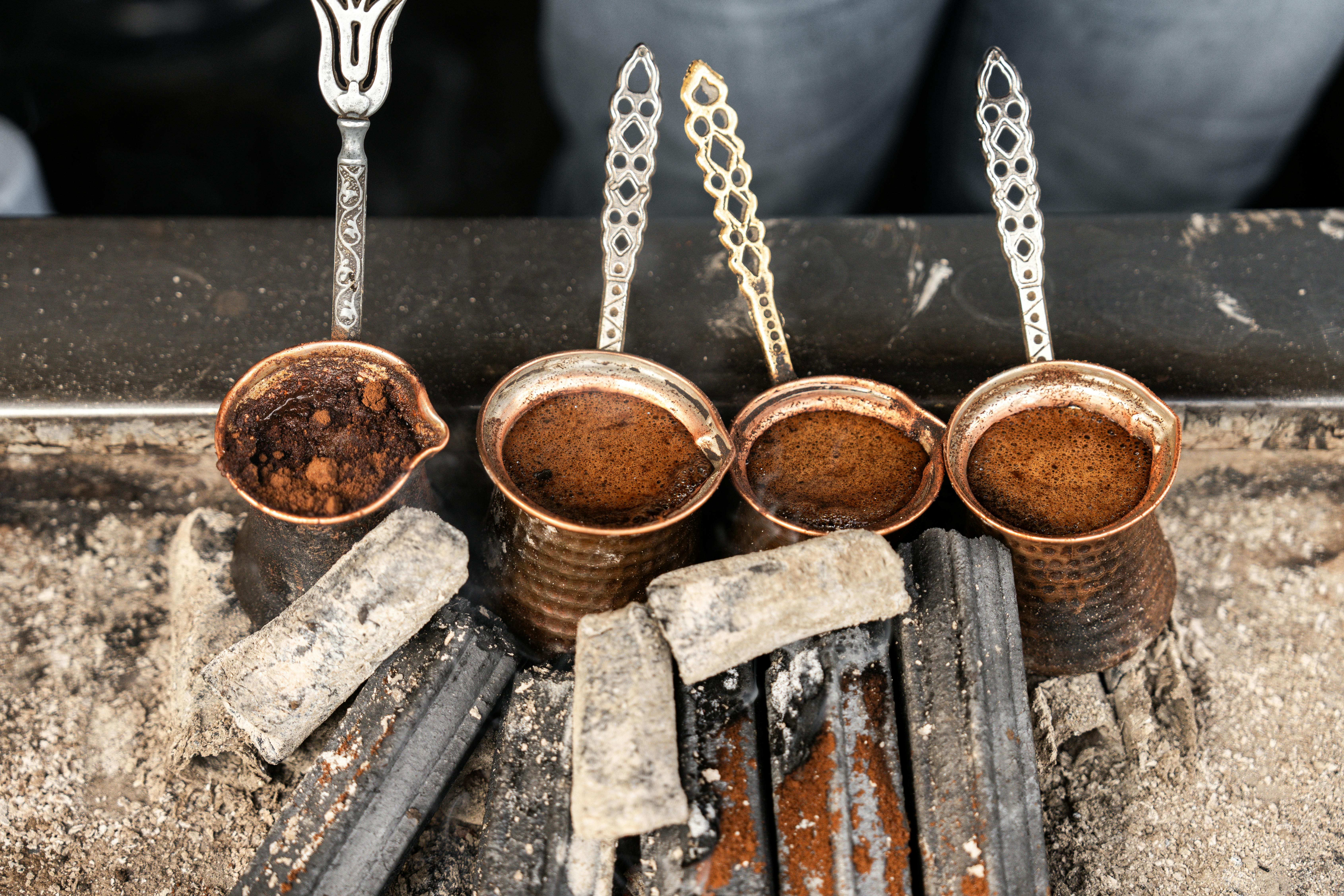 Traditional Turkish Coffee Brewing on Sand · Free Stock Photo