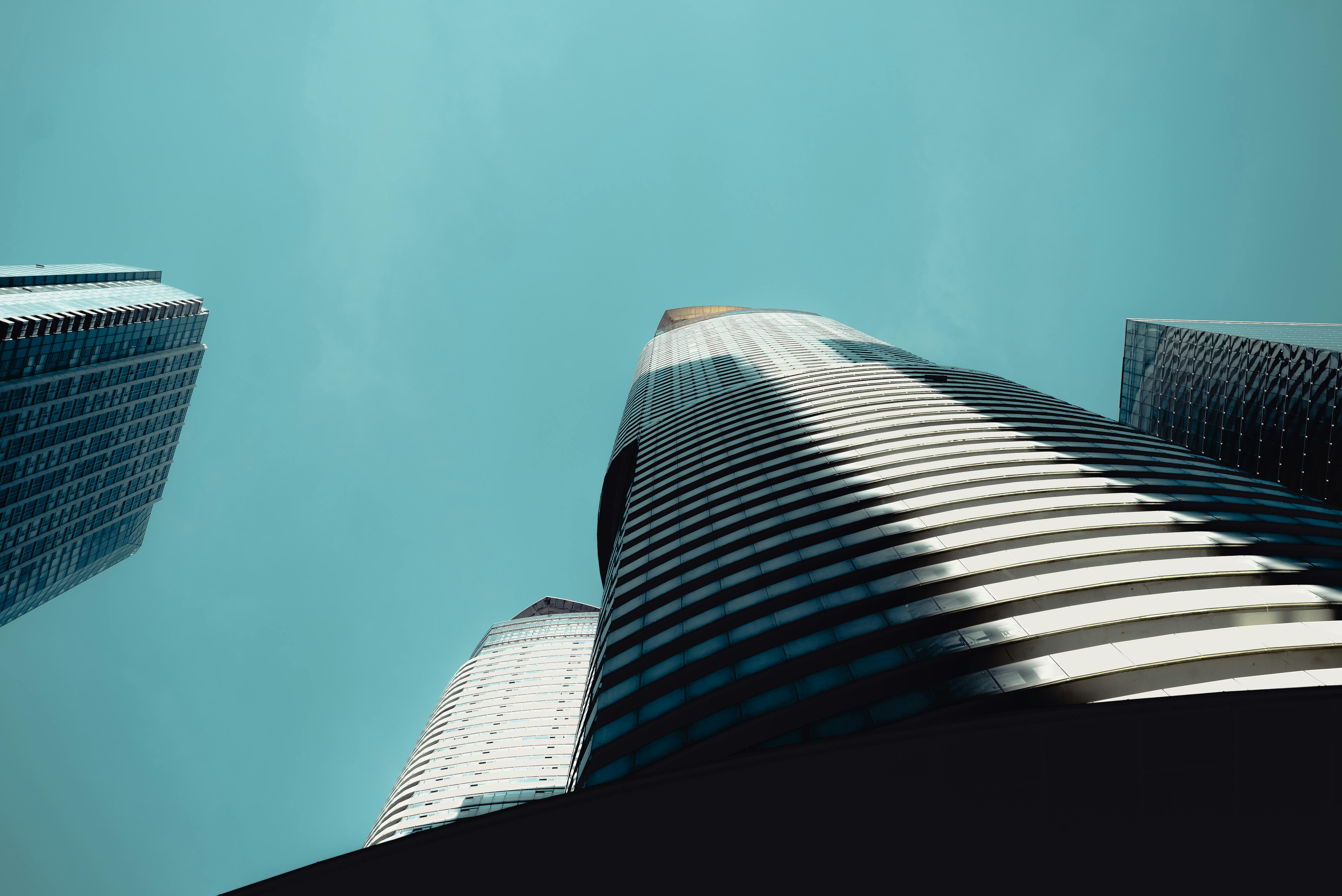 Contemporary skyscraper facades with geometric walls in city · Free ...