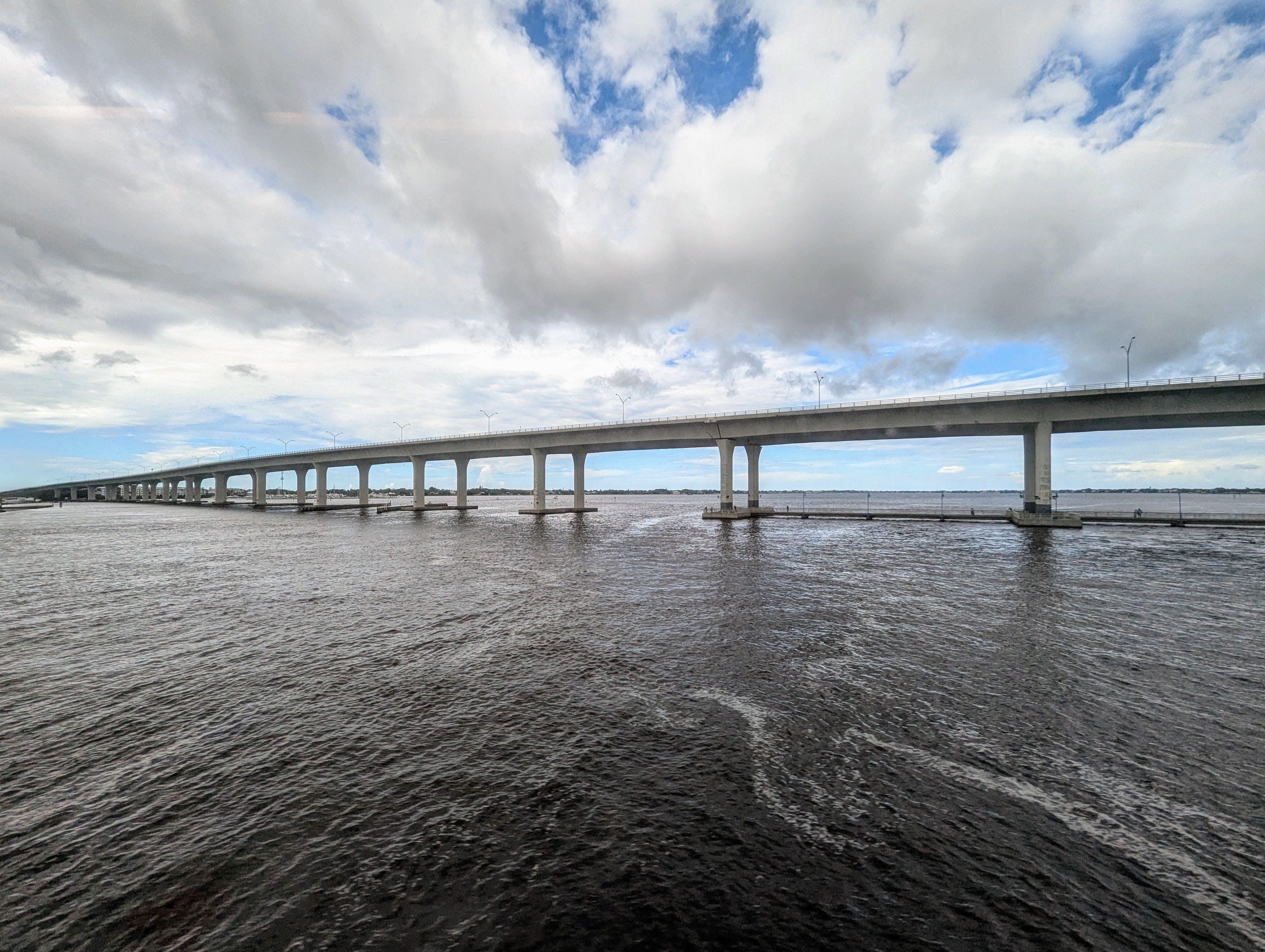 Long span bridge over expansive river · Free Stock Photo