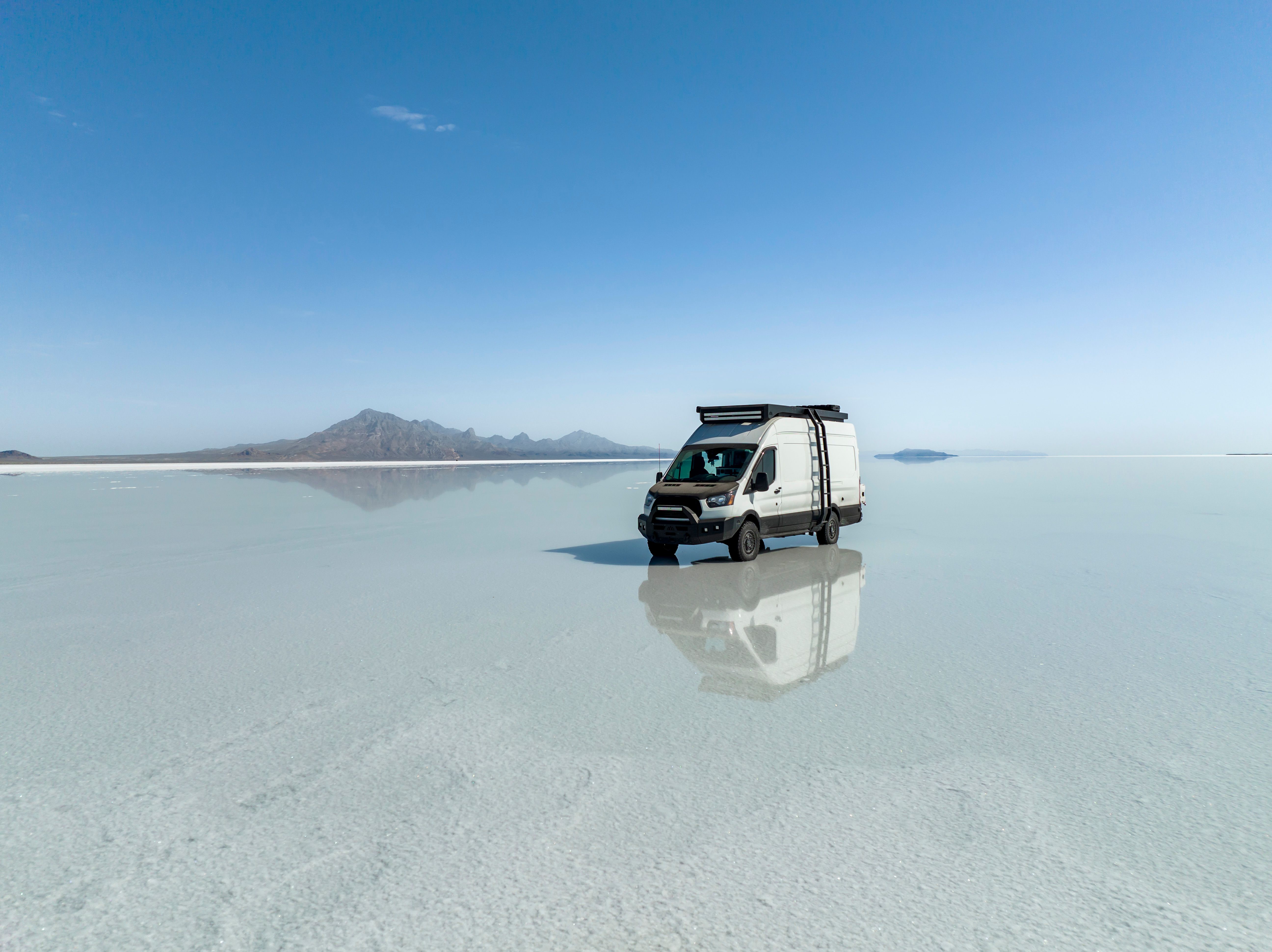 White Van on Bonneville Salt Flats Under Clear Sky · Free Stock Photo