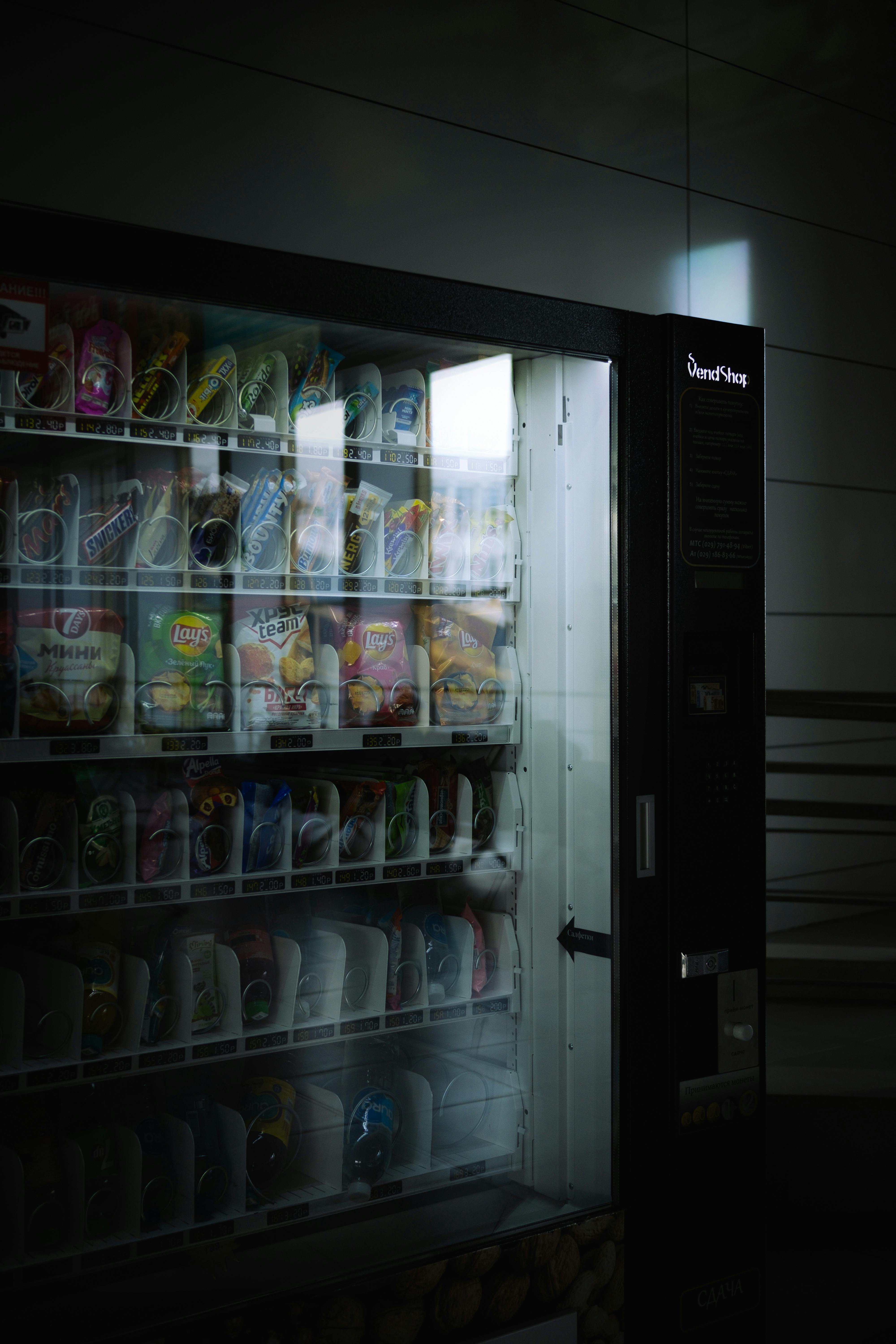 Dimly Lit Vending Machine Interior View · Free Stock Photo