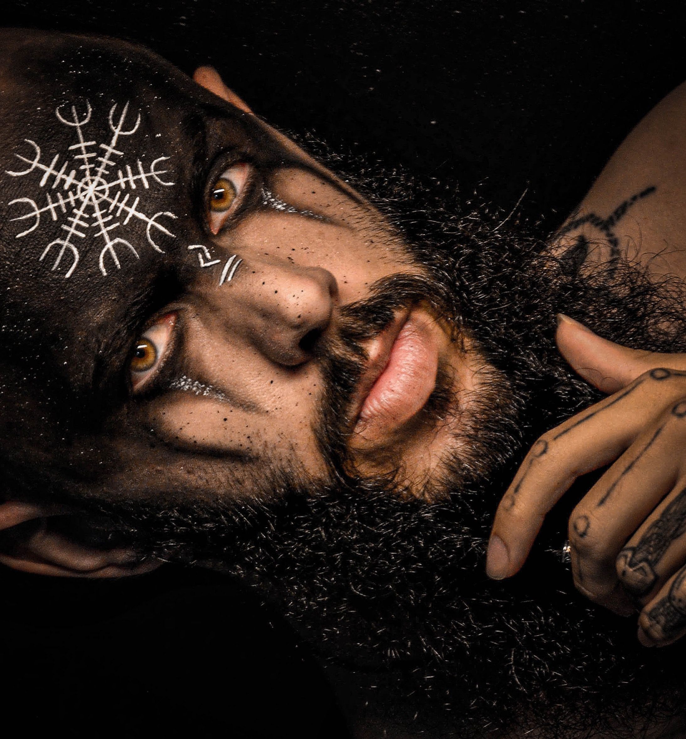 Dramatic Portrait with Intricate Face Paint Design · Free Stock Photo
