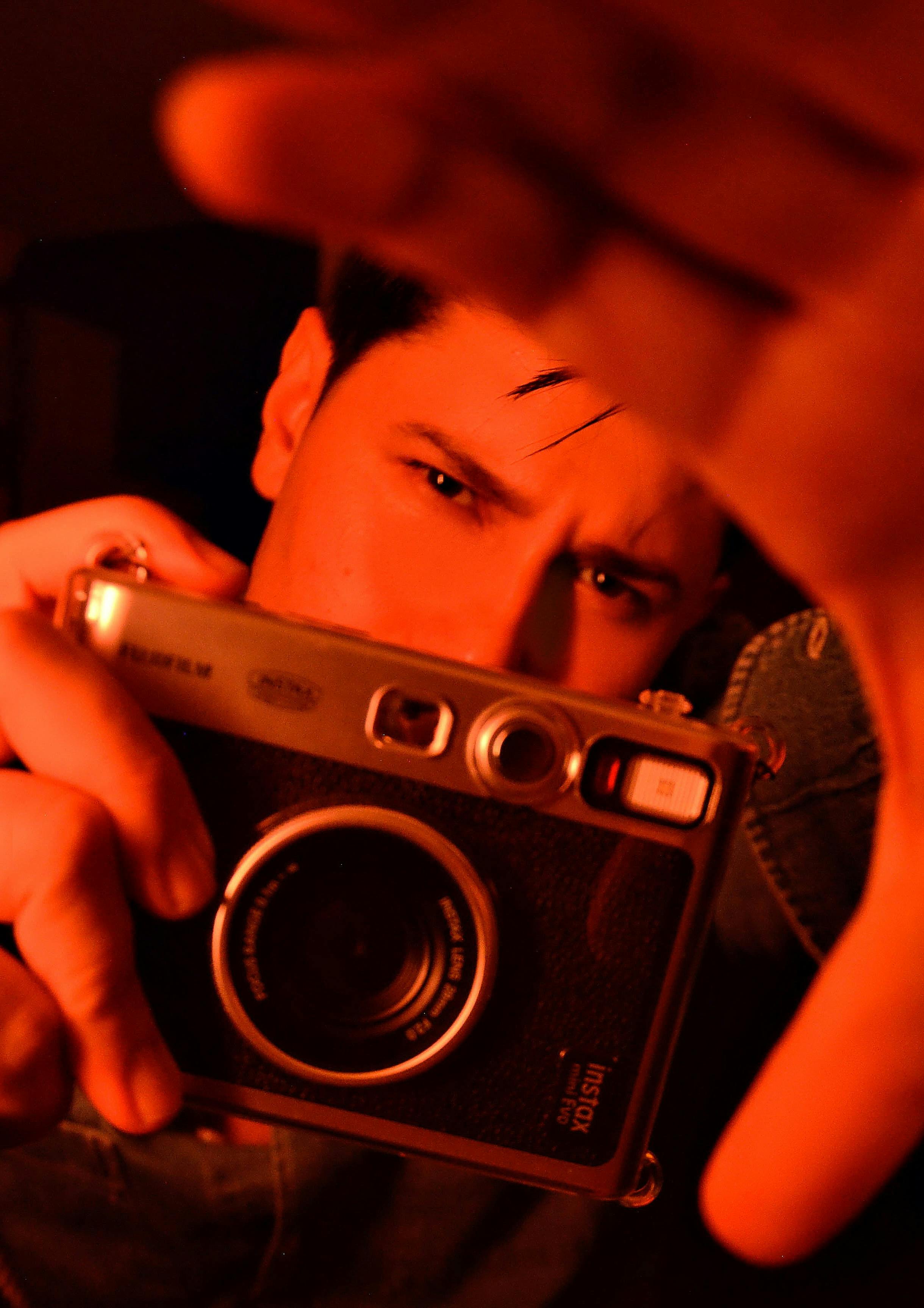 Creative Portrait of Photographer with Camera · Free Stock Photo