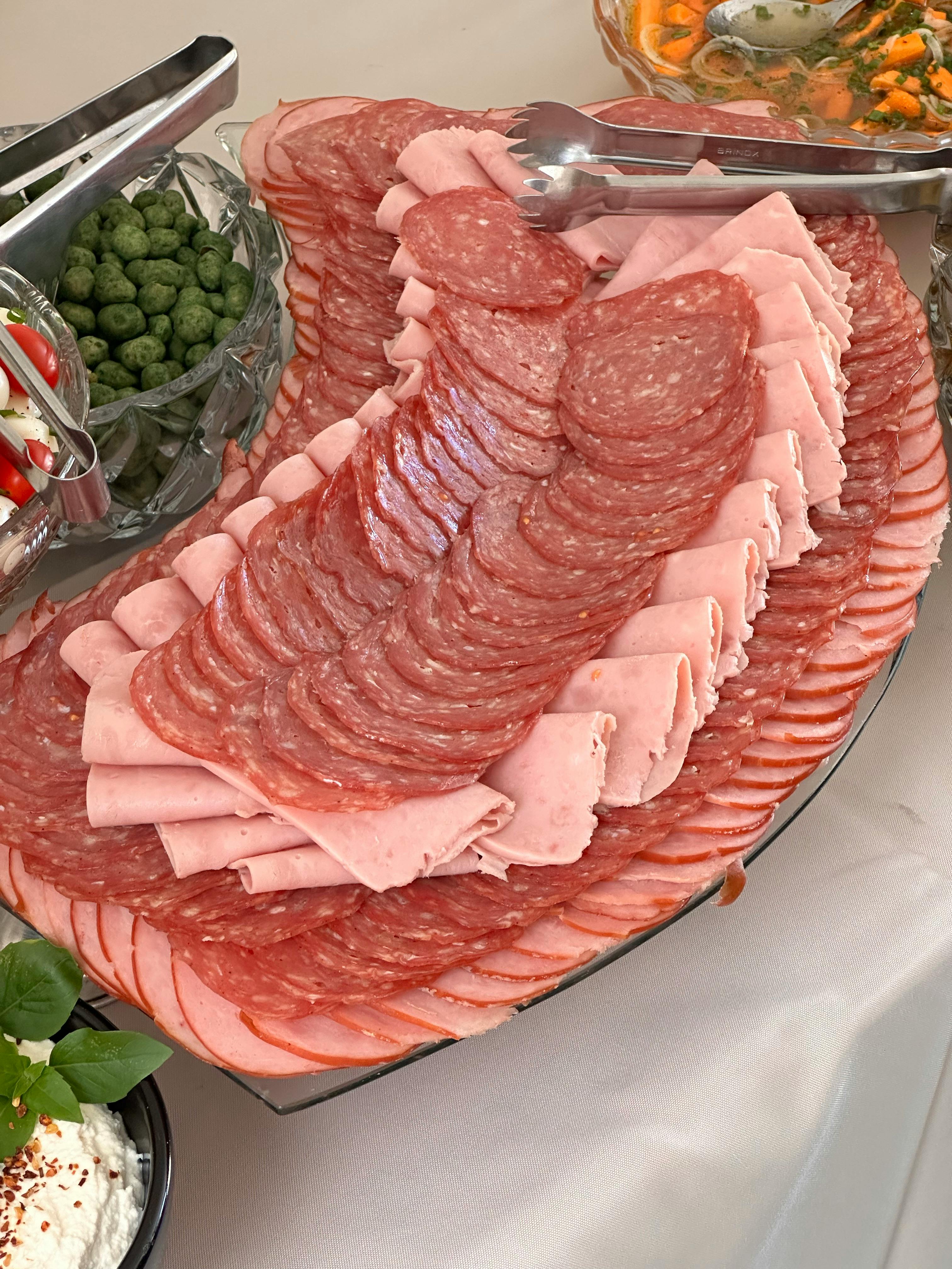 Delicious Array of Sliced Cold Cuts Displayed · Free Stock Photo