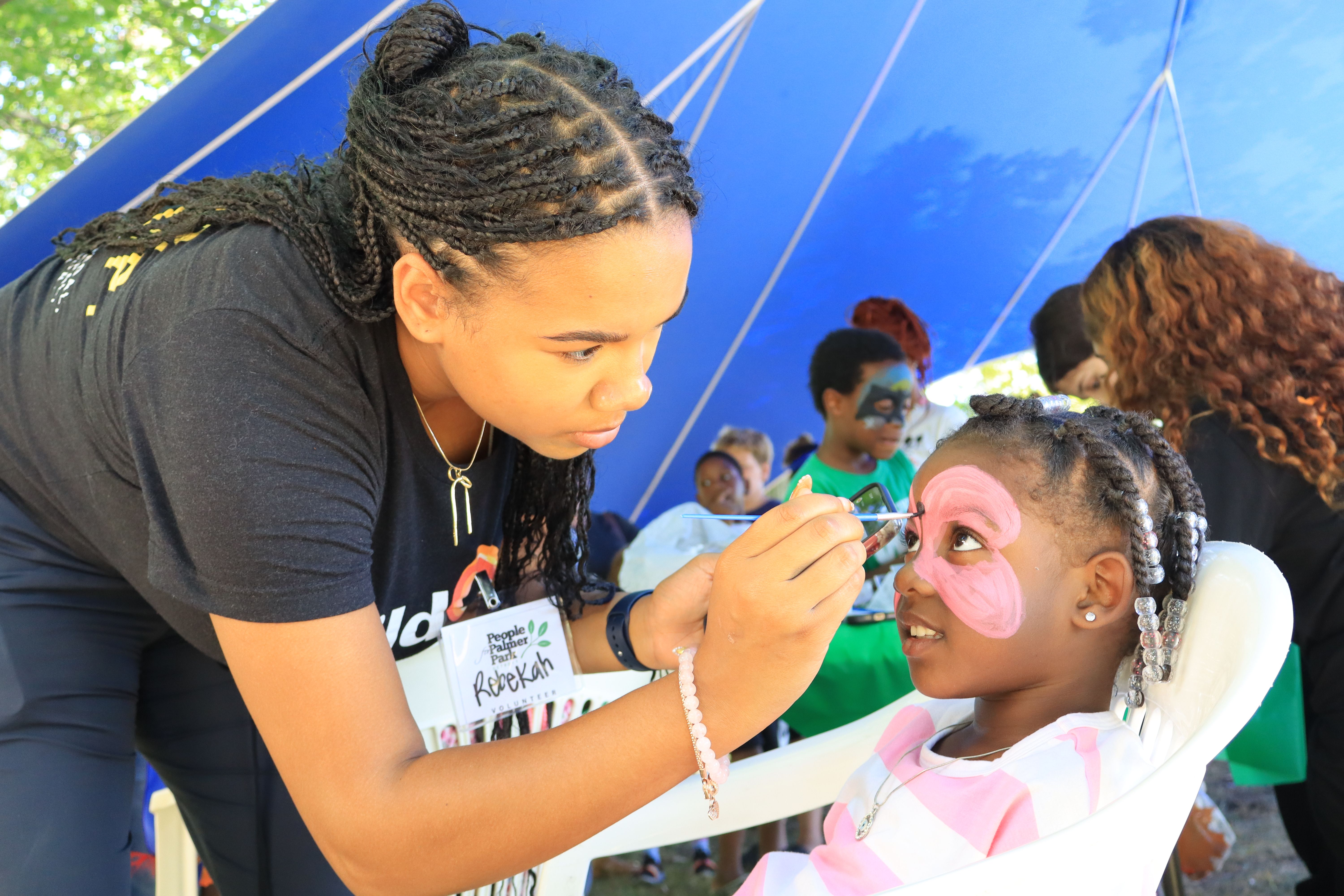 Face Painting at Outdoor Family Festival · Free Stock Photo