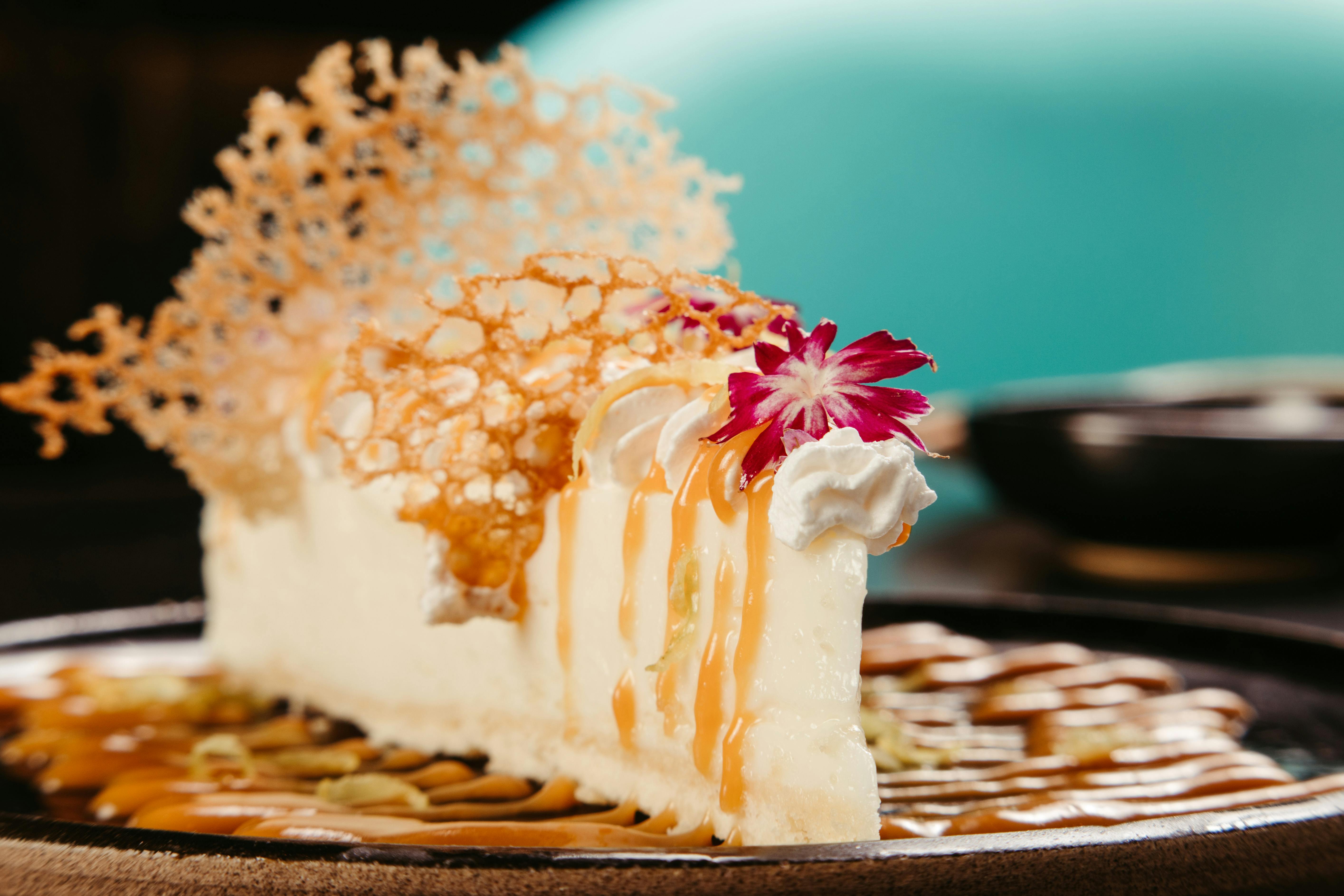 Delicious Cheesecake With Caramel Drizzle and Edible Flower · Free ...