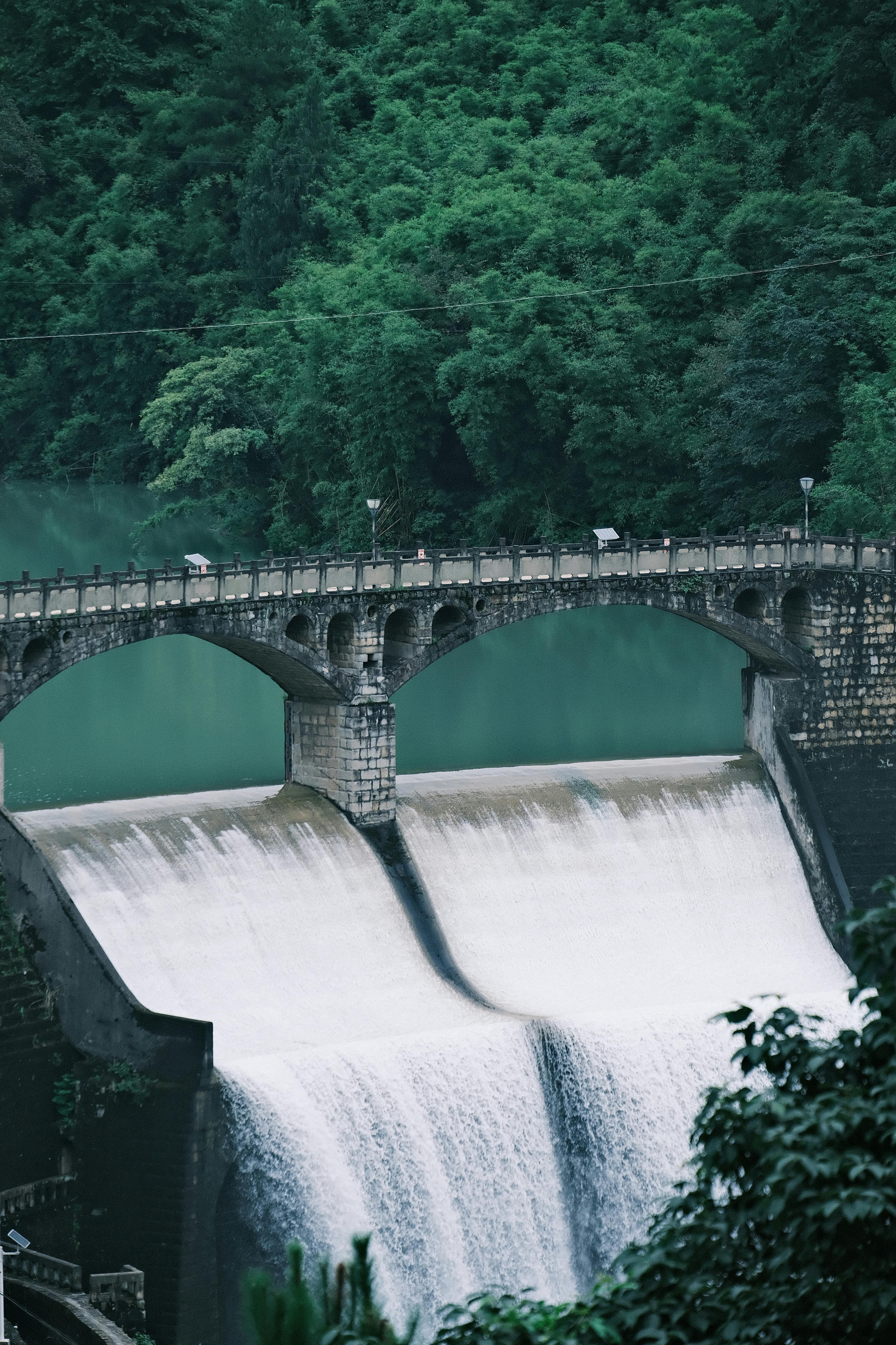 Scenic Summer View of Stone Bridge Over Waterfall · Free Stock Photo