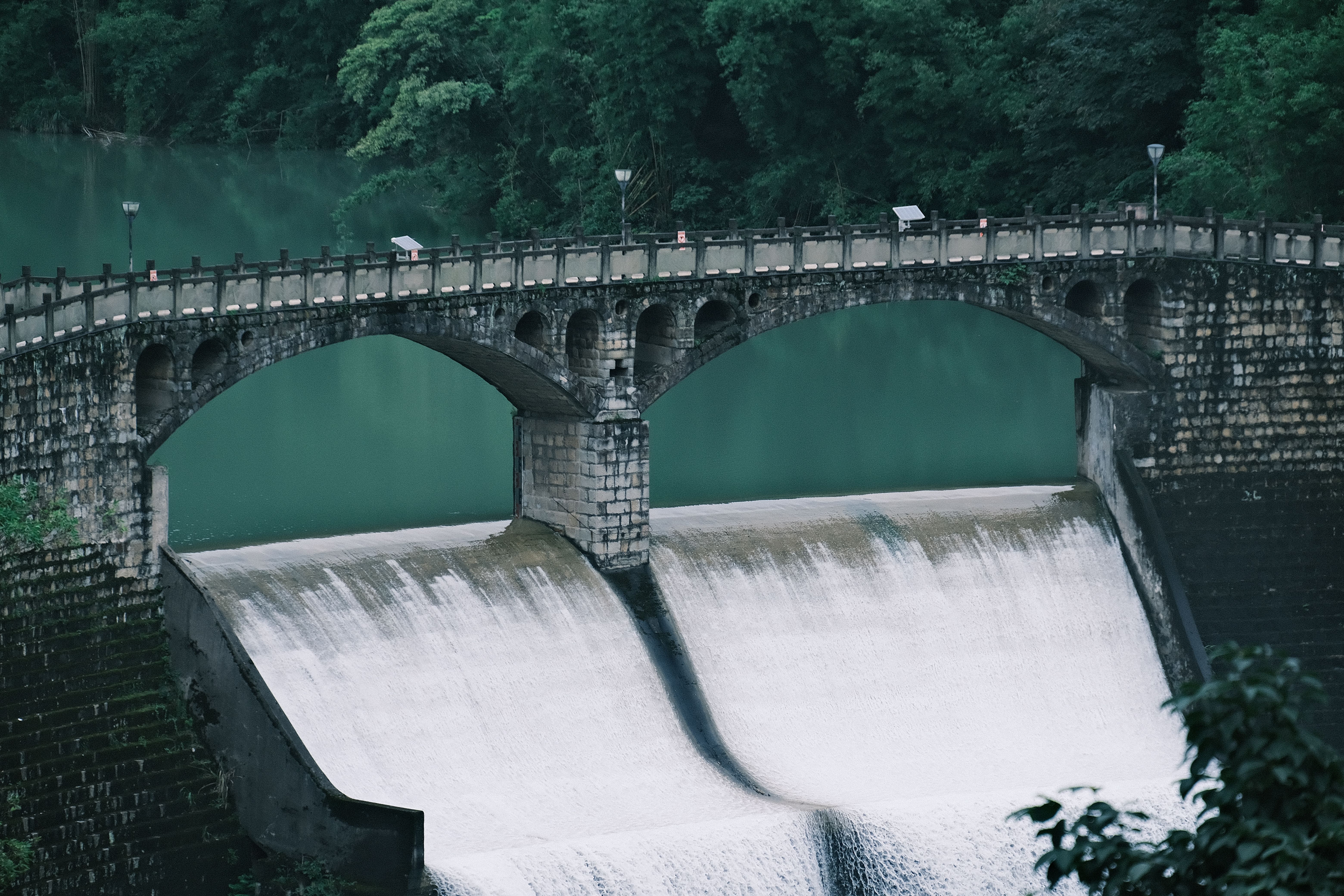 Scenic Bridge Over Flowing Dam and River · Free Stock Photo