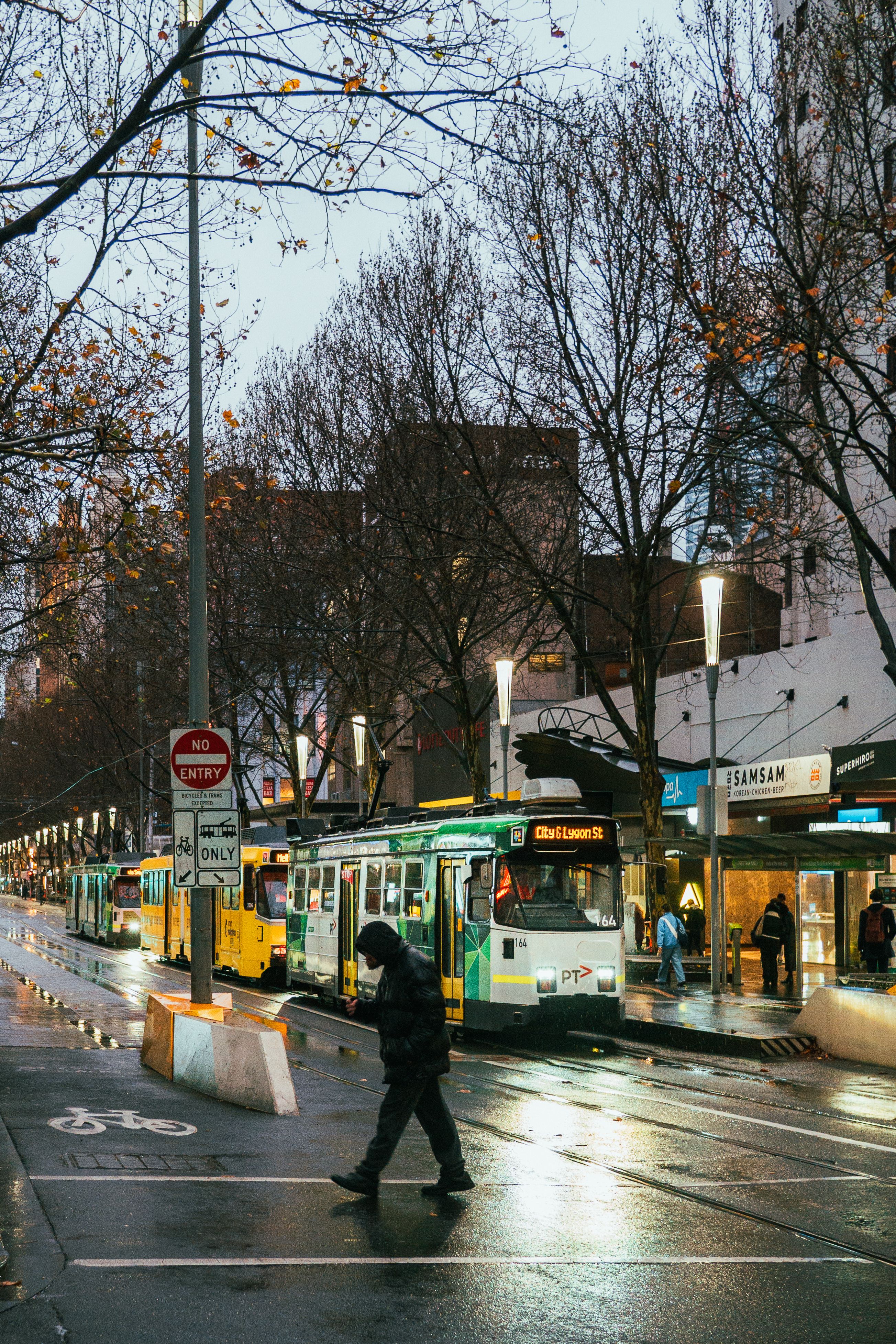 Melbourne Rainy Evening with Trams and City Lights · Free Stock Photo
