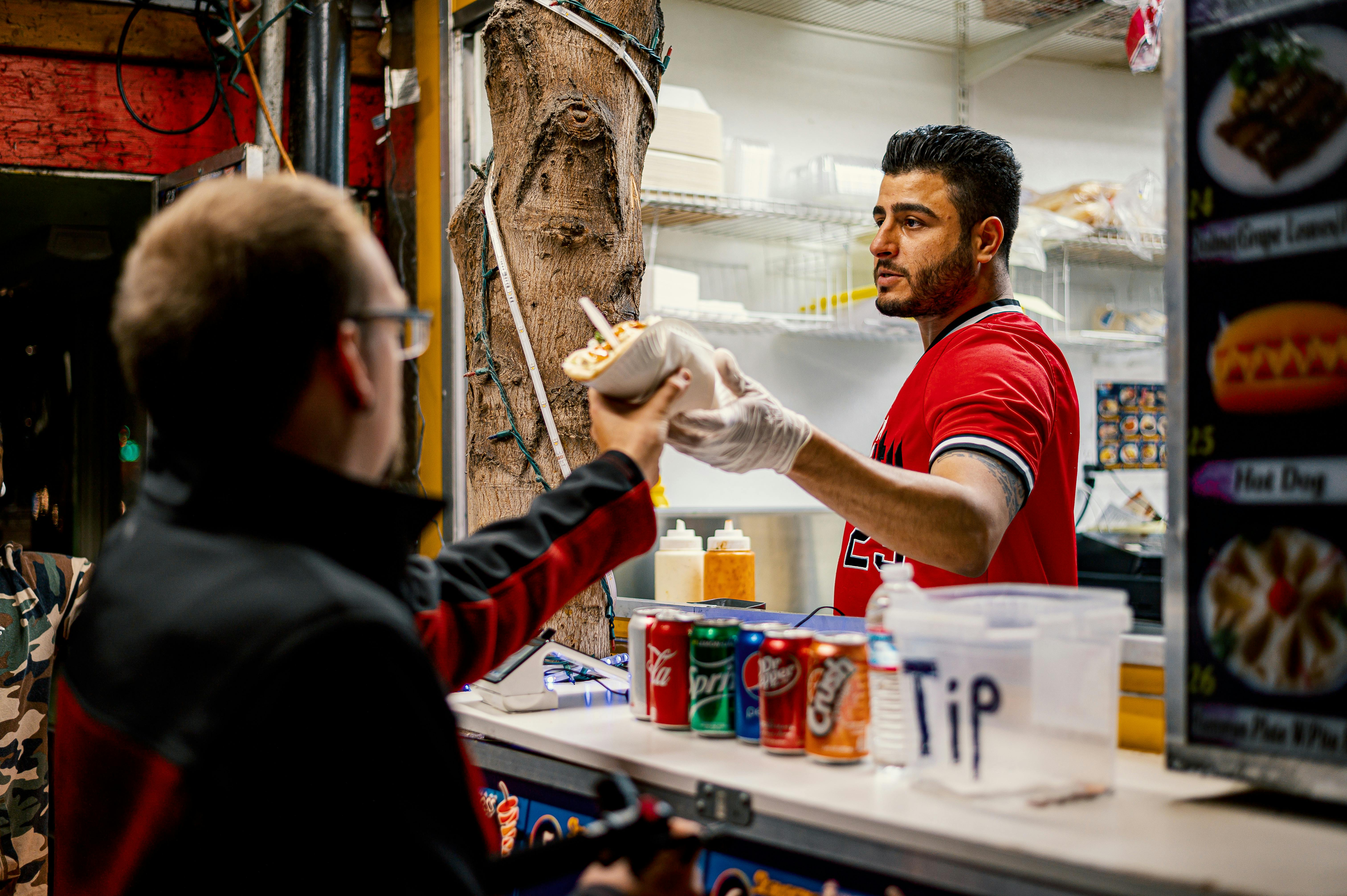 A Man Ordering Food on a Food Truck · Free Stock Photo