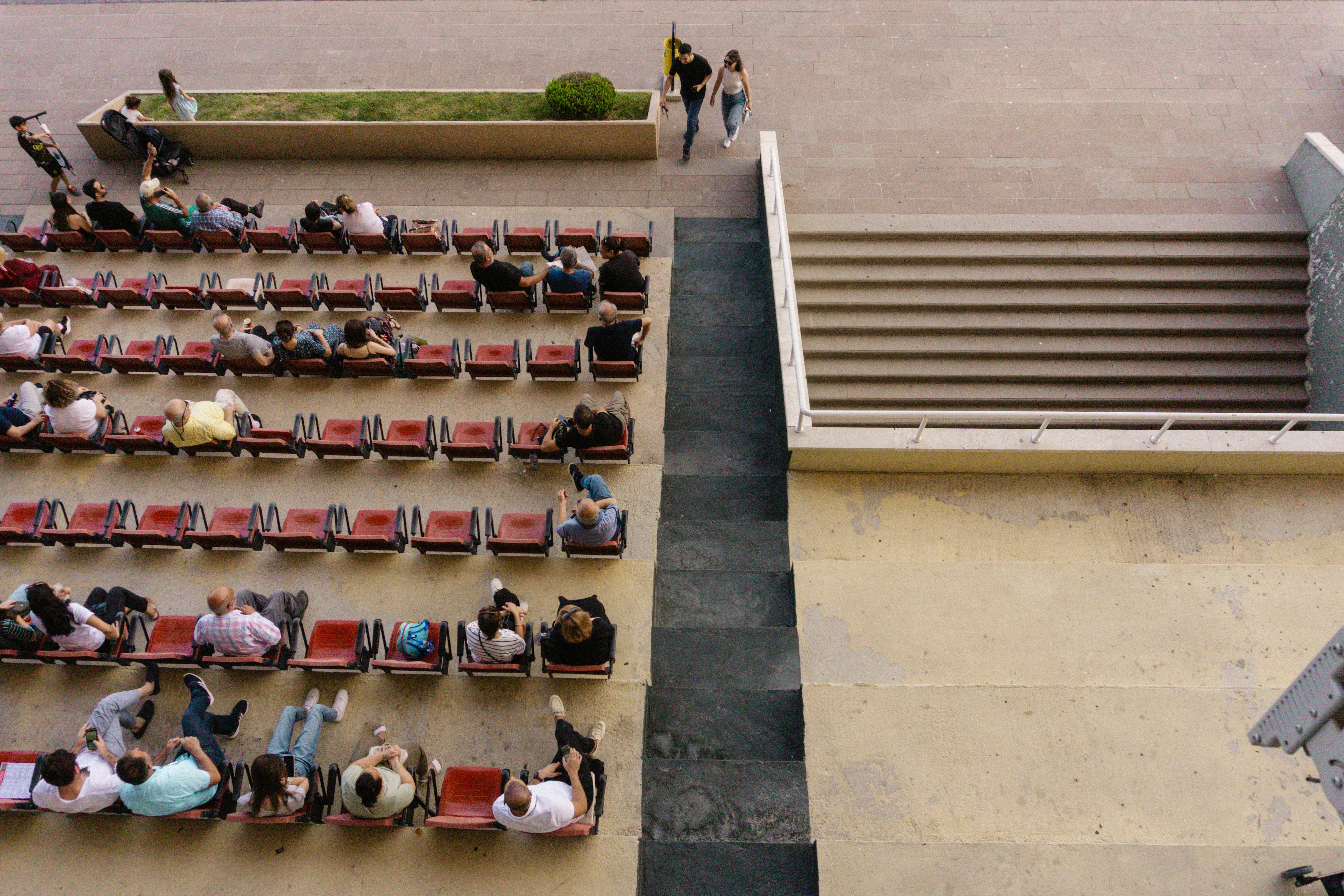 Outdoor Auditorium with Seated Audience and Stairs · Free Stock Photo