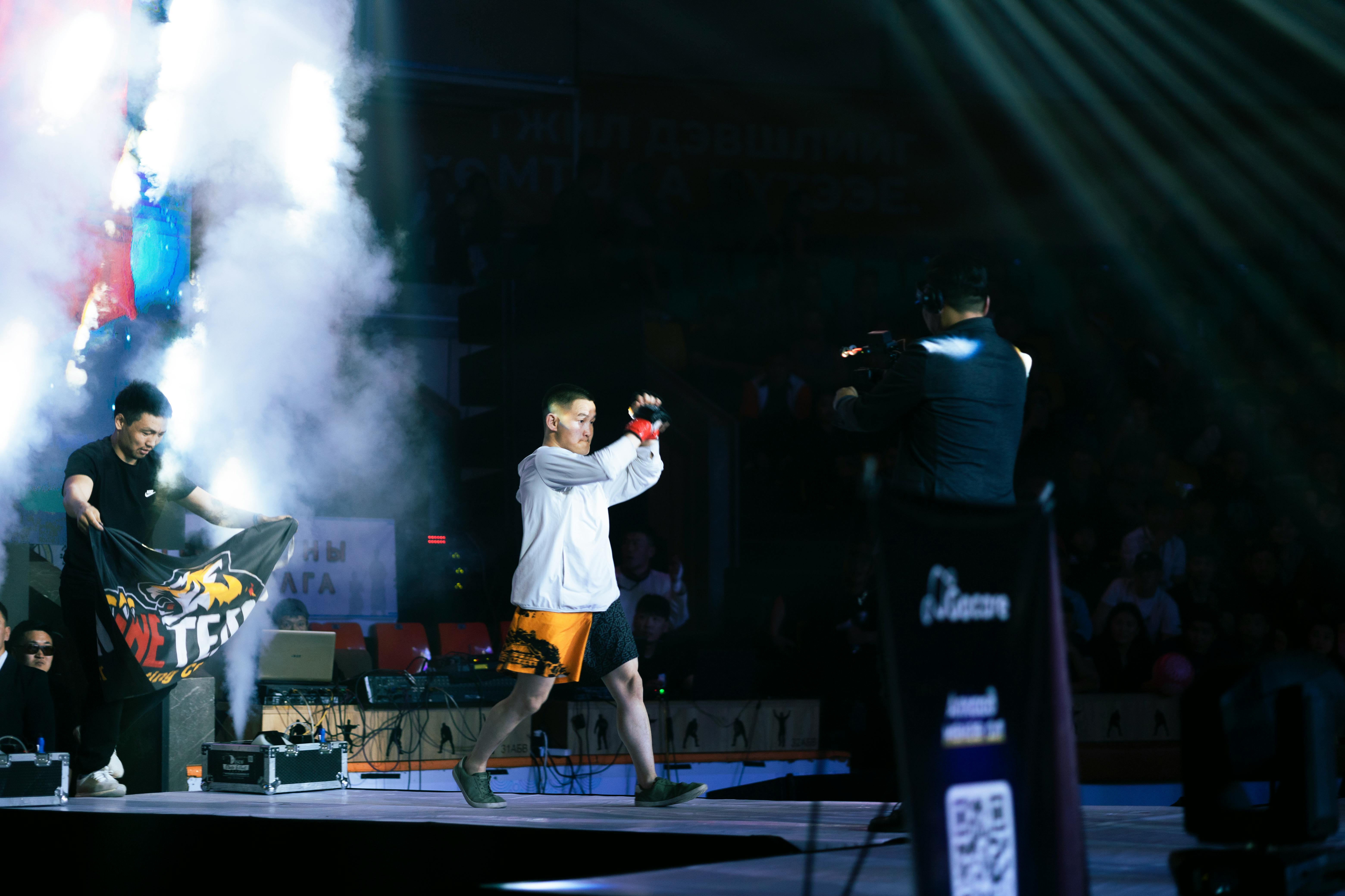 Dynamic Entrance of MMA Fighter in Arena · Free Stock Photo