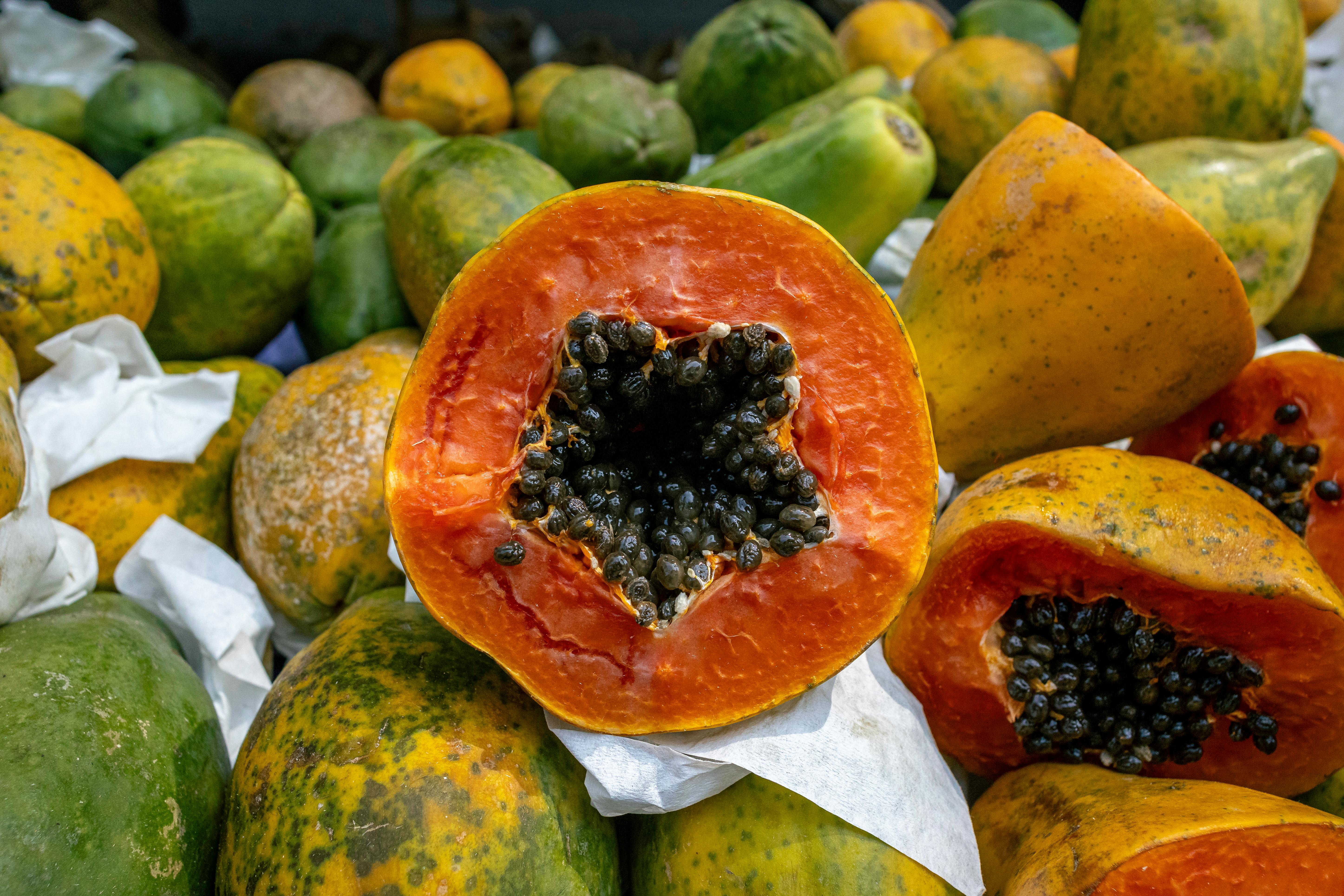 Fresh ripe papaya on white table · Free Stock Photo