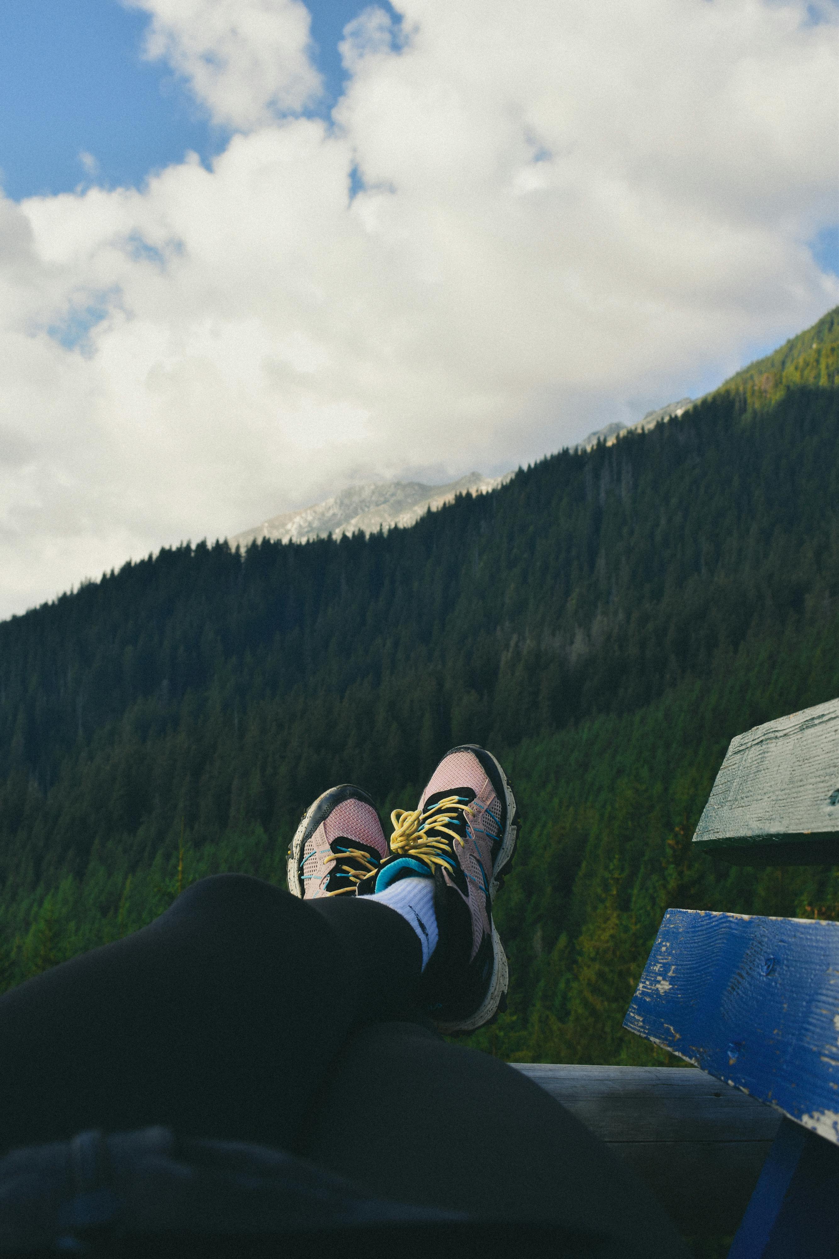 Relaxed Mountain View with Hiking Shoes · Free Stock Photo