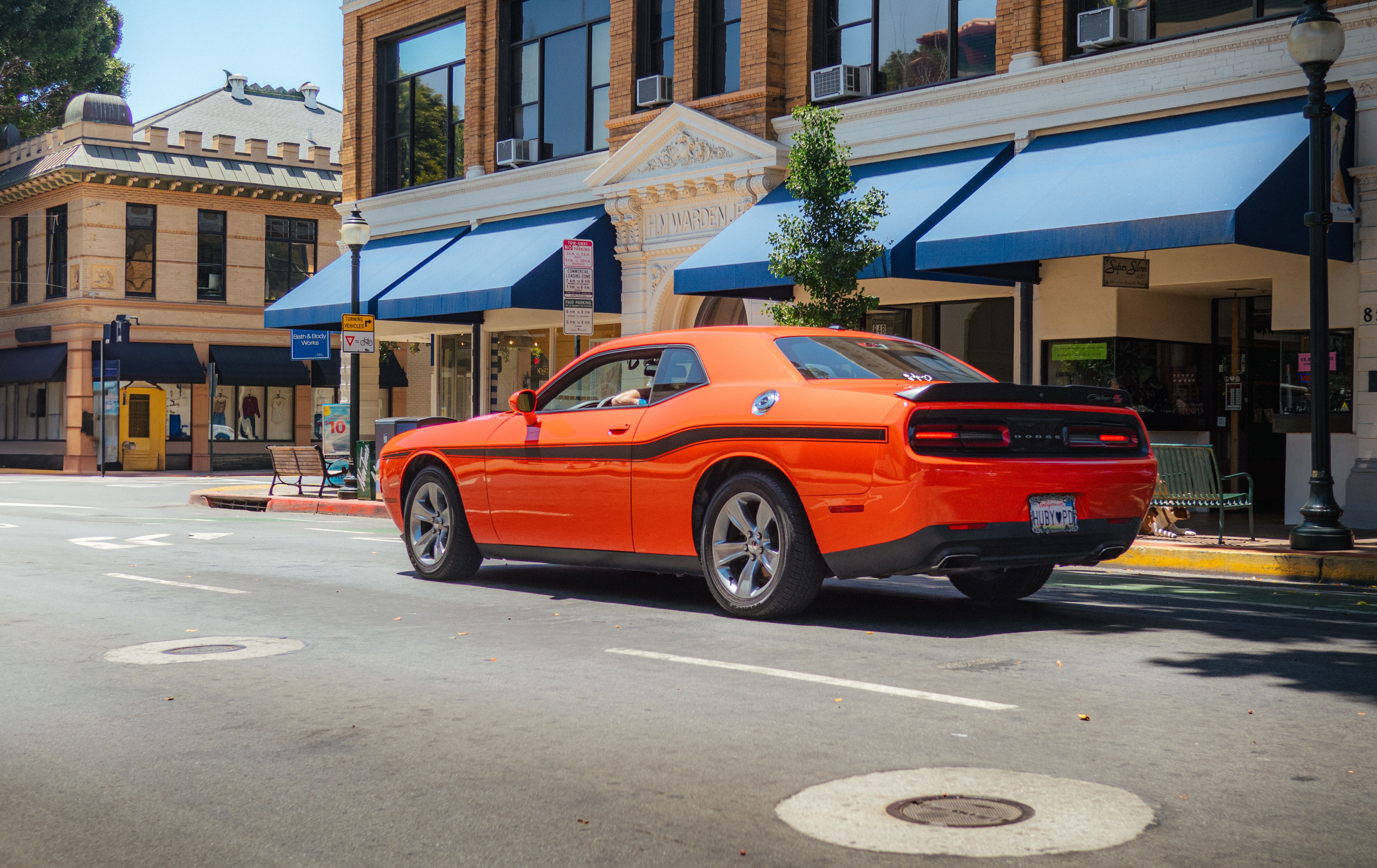 Dodge Challenger with Blue Headlights Reflecting in the Street Surface ...