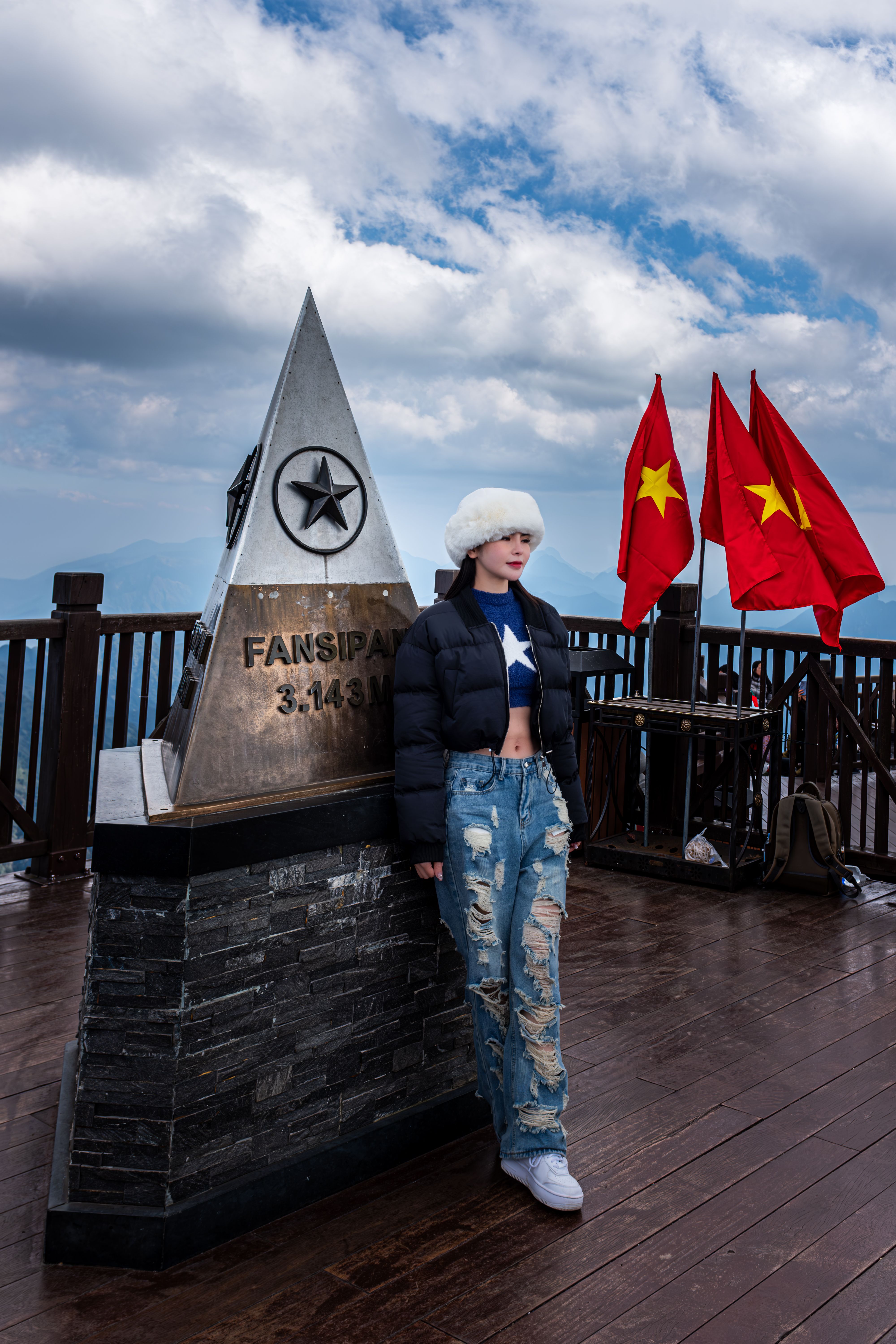 Tourist at Fansipan Summit with Vietnamese Flags · Free Stock Photo