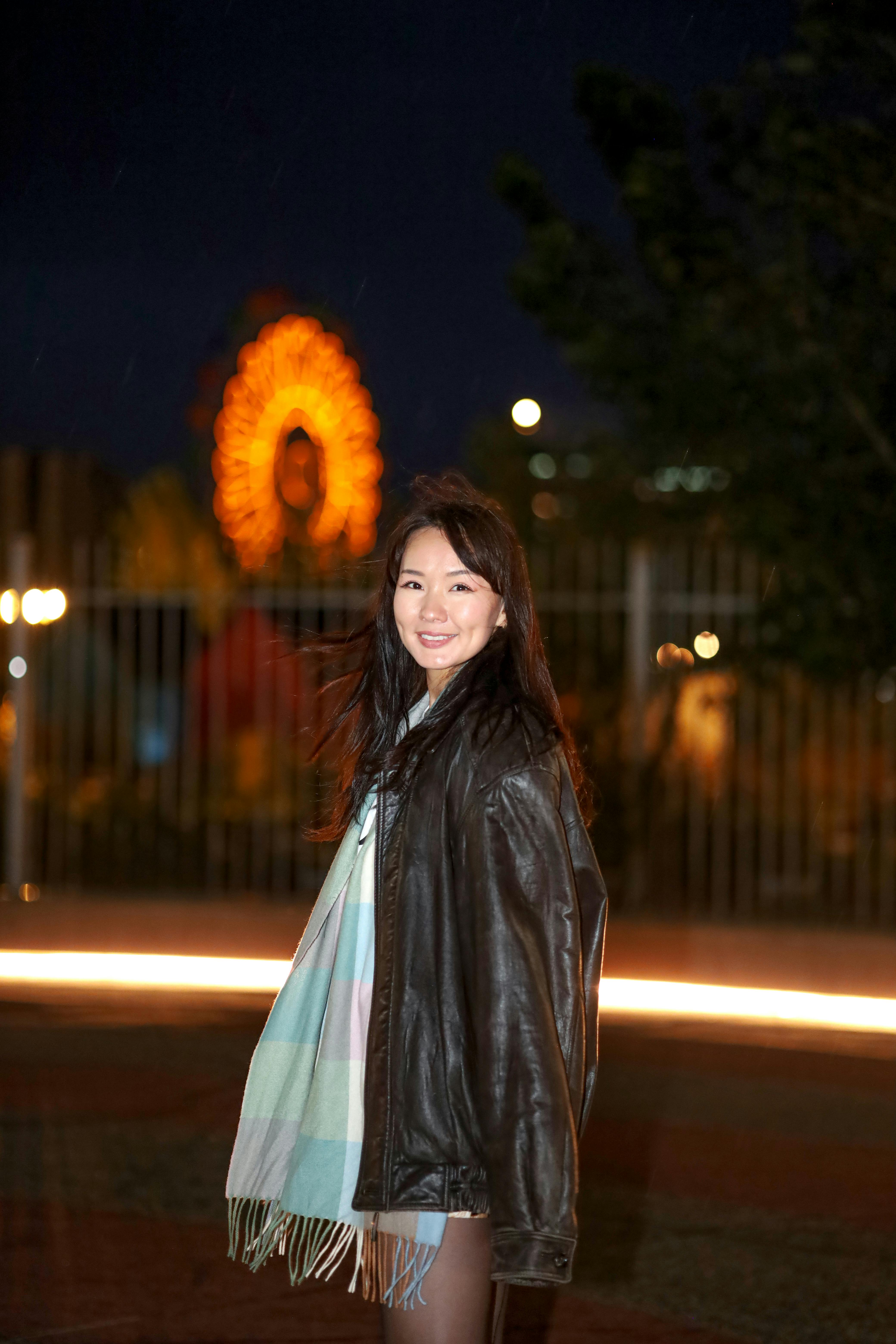 Nighttime Portrait with Ferris Wheel Background · Free Stock Photo