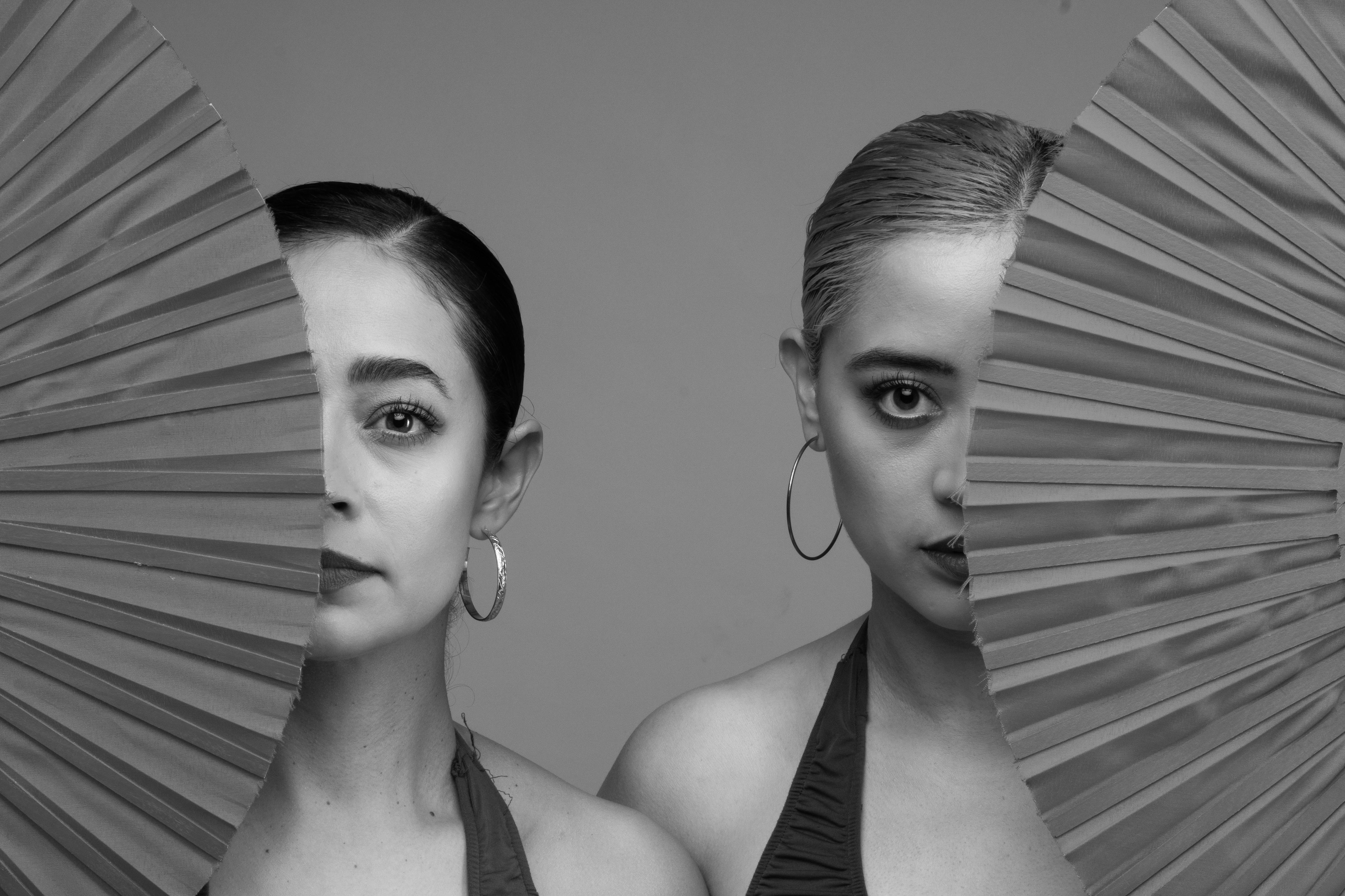 Artistic Portrait of Two Women with Fans · Free Stock Photo