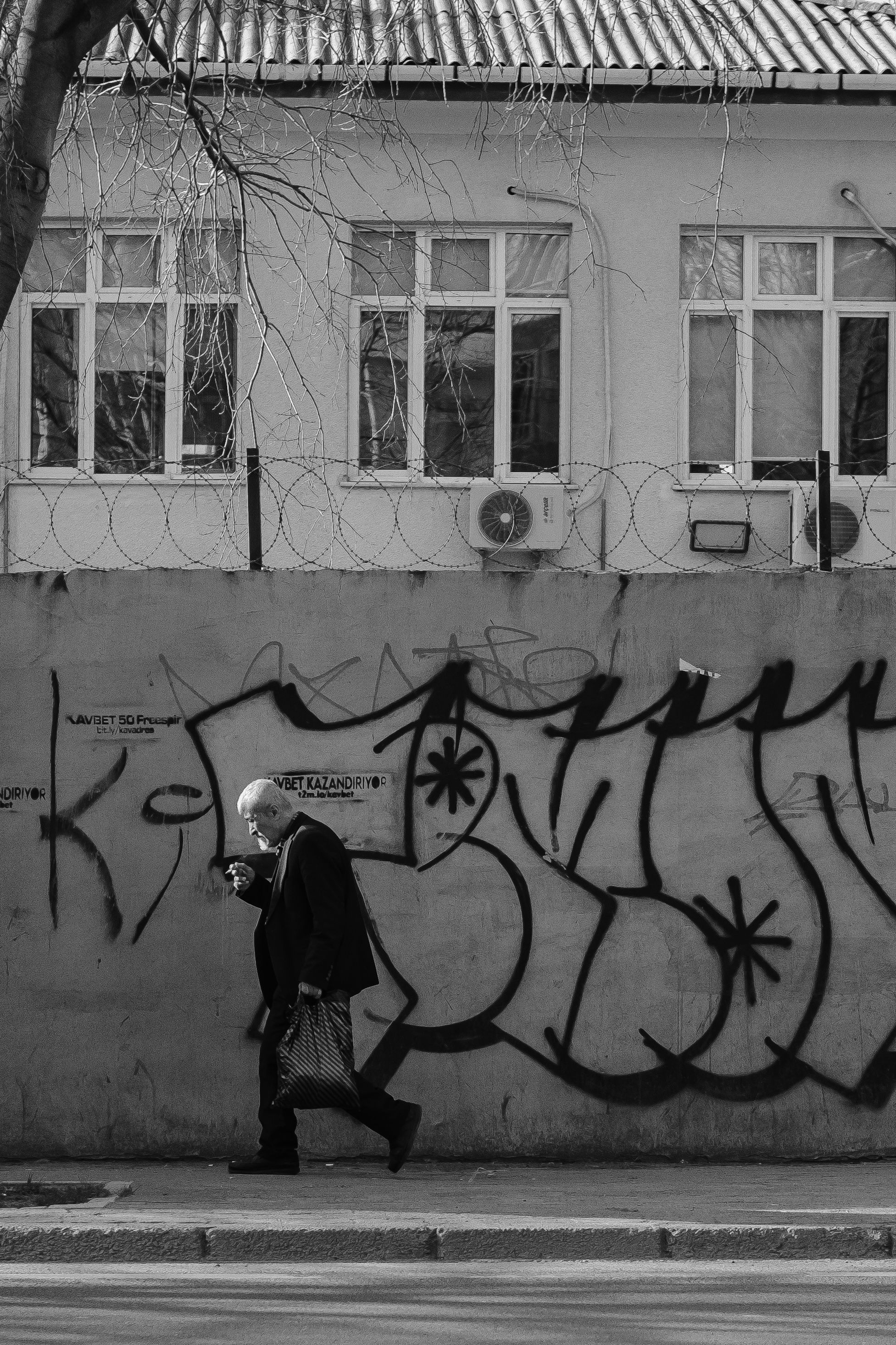 Elderly Man Walking by Graffiti Wall in İstanbul · Free Stock Photo