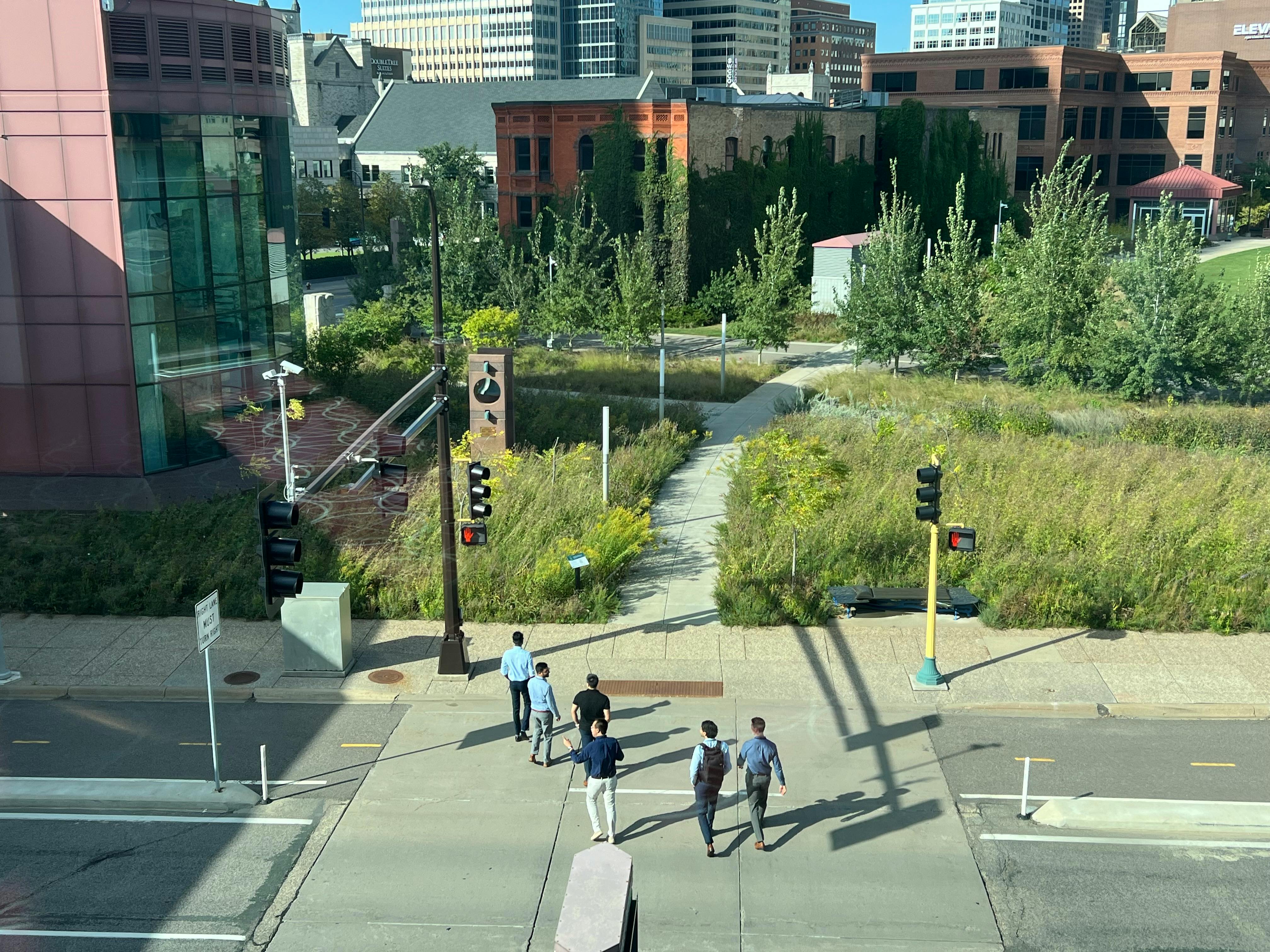 Urban Pathway with Pedestrians and Cityscape View · Free Stock Photo