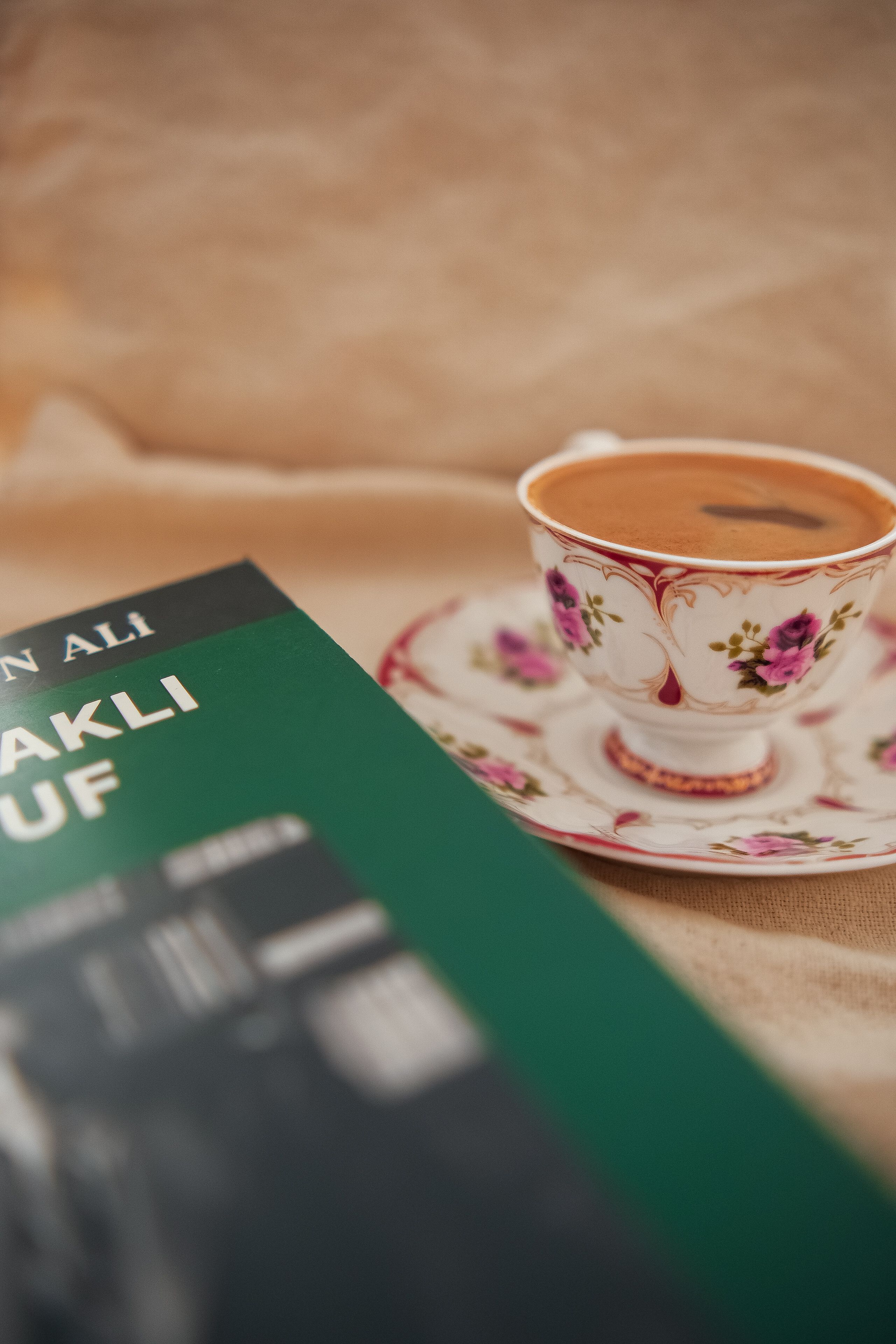 Elegant Tea Cup and Book with Vintage Decor · Free Stock Photo