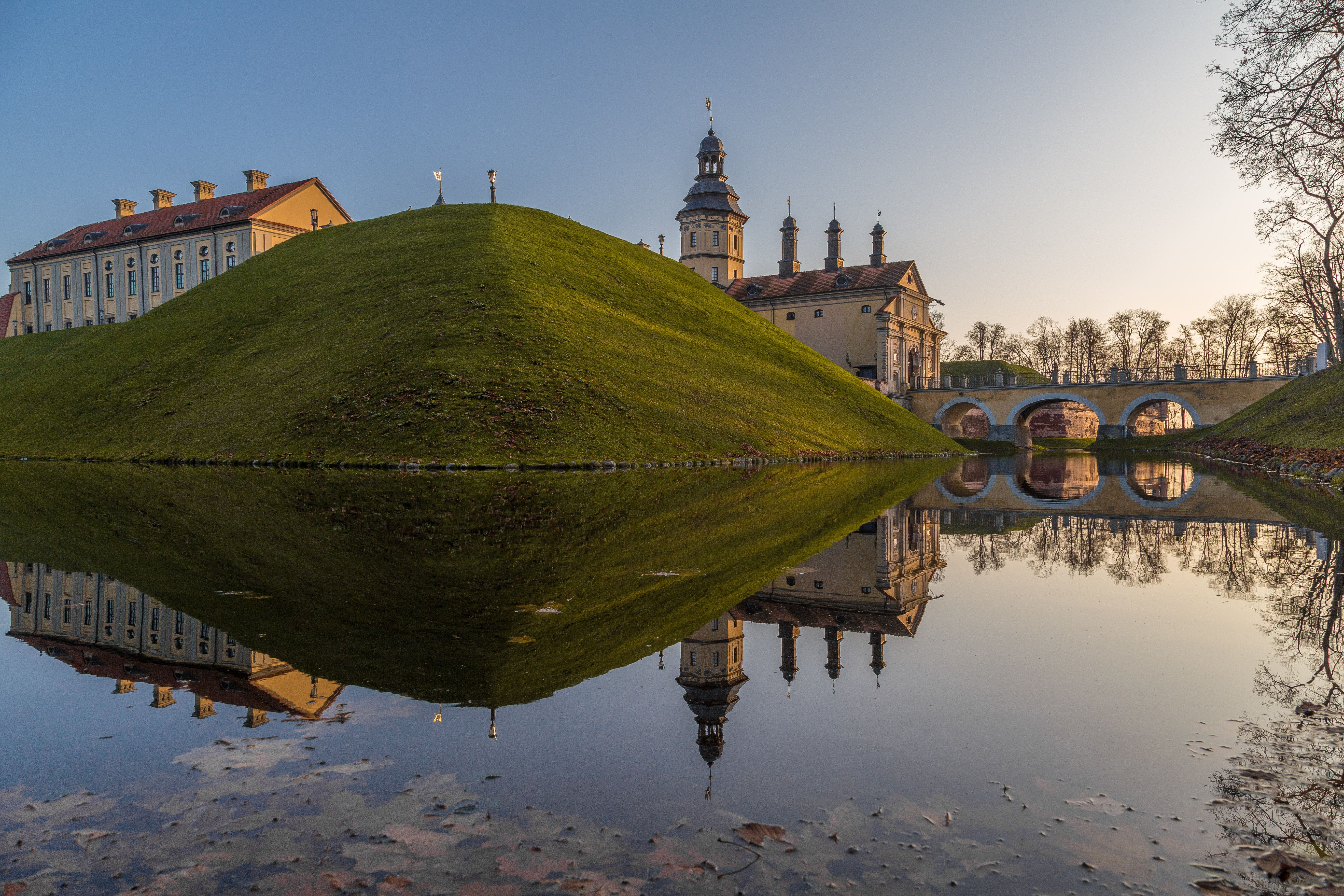 Scenic Reflection of Historic Castle in Sunset Light · Free Stock Photo