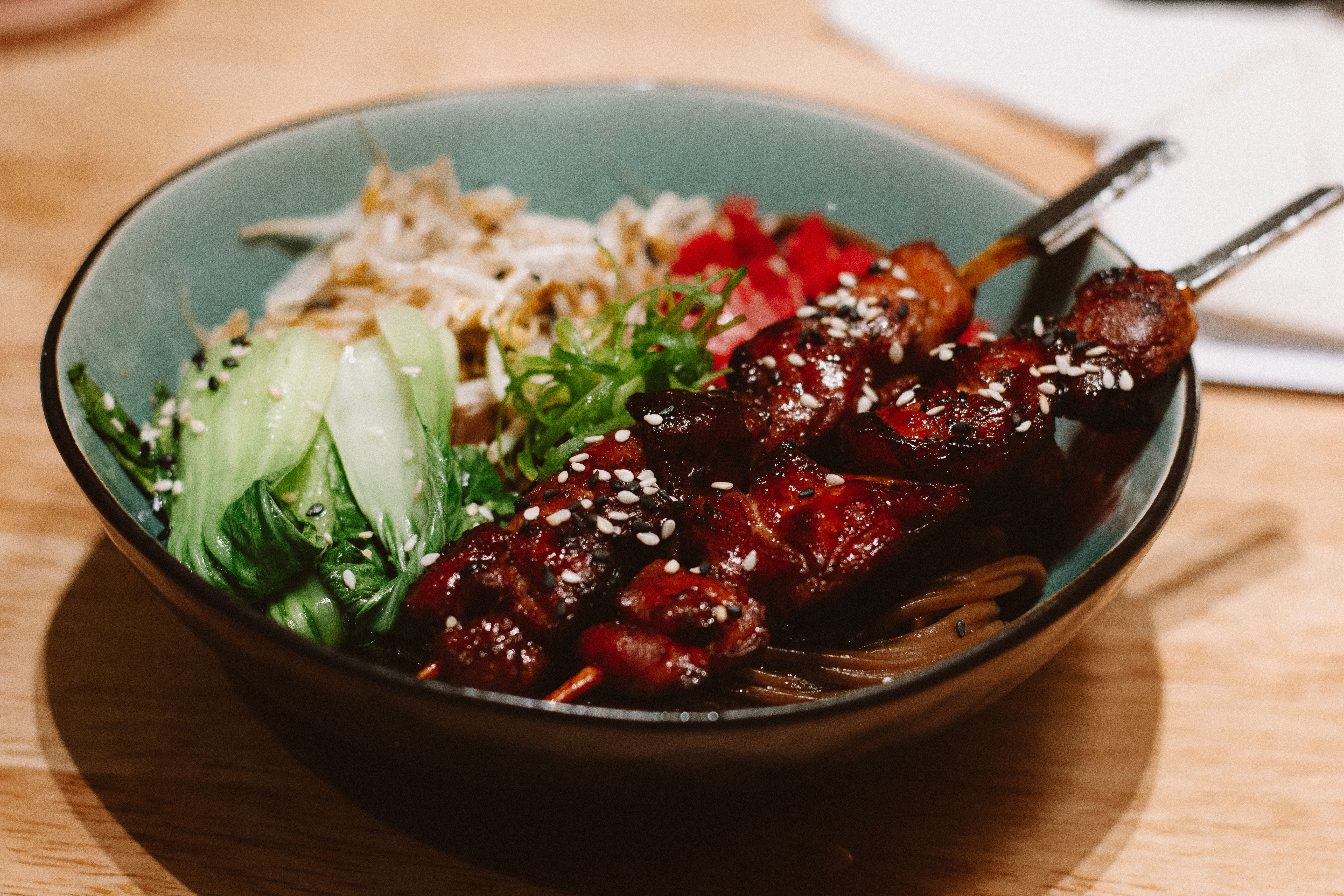 Delicious Asian Fusion Bowl with Grilled Skewers · Free Stock Photo