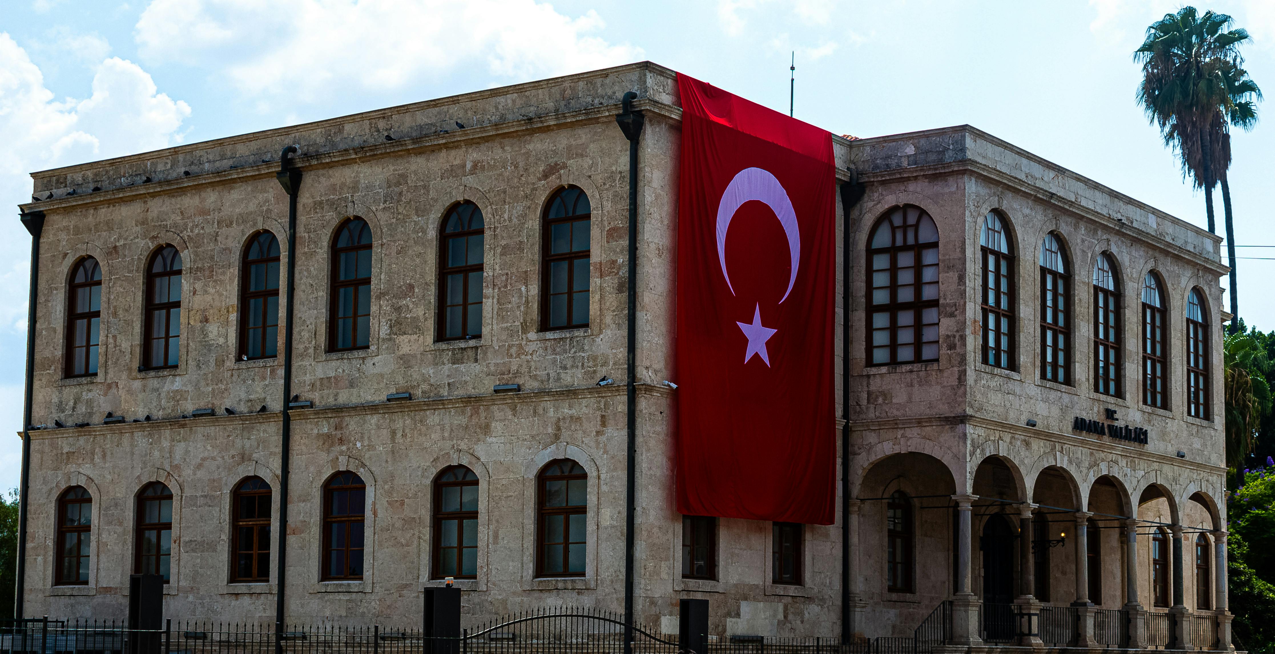Historic Building with Turkish Flag in Adana · Free Stock Photo