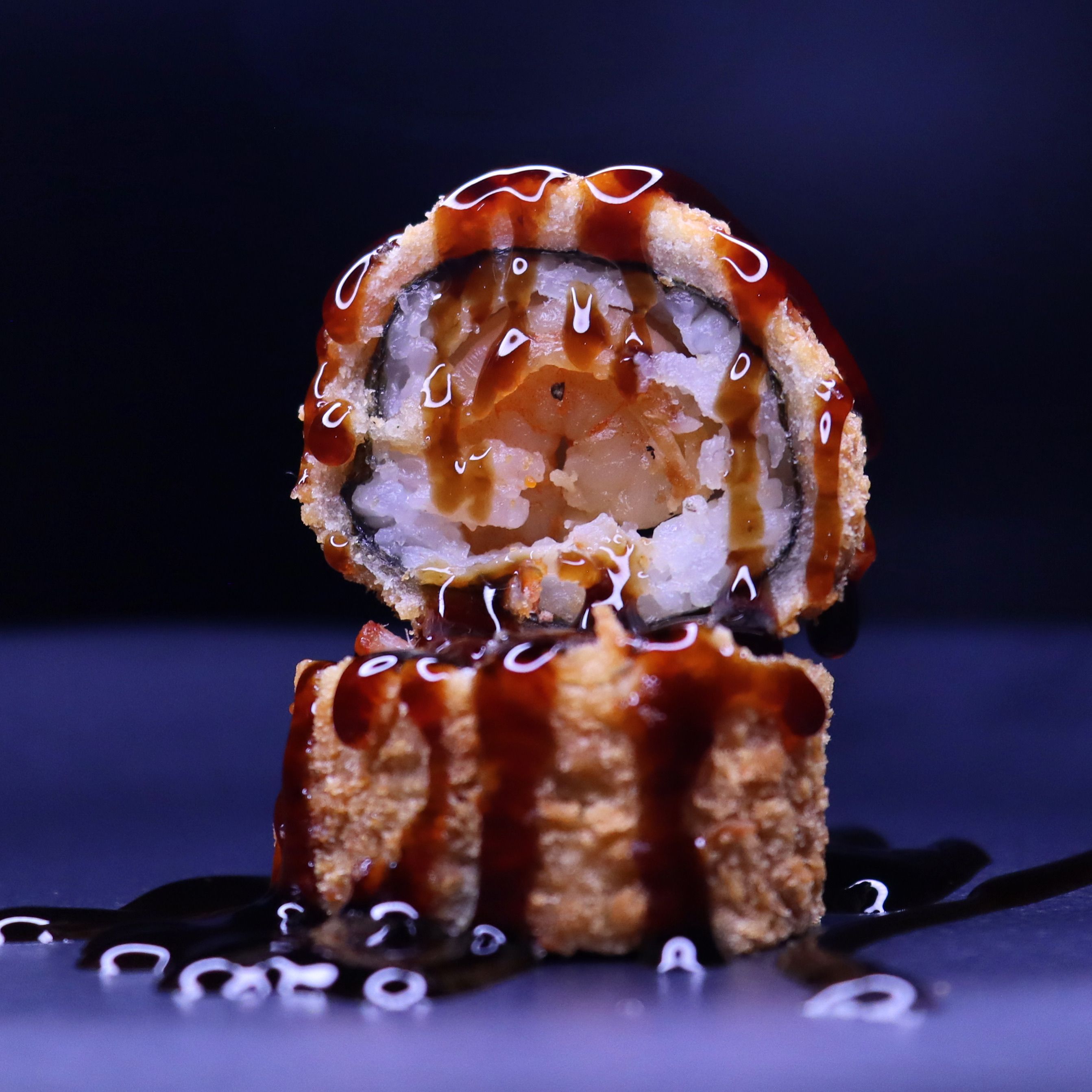 Close-up of Delicious Sushi with Sauce Drizzle · Free Stock Photo
