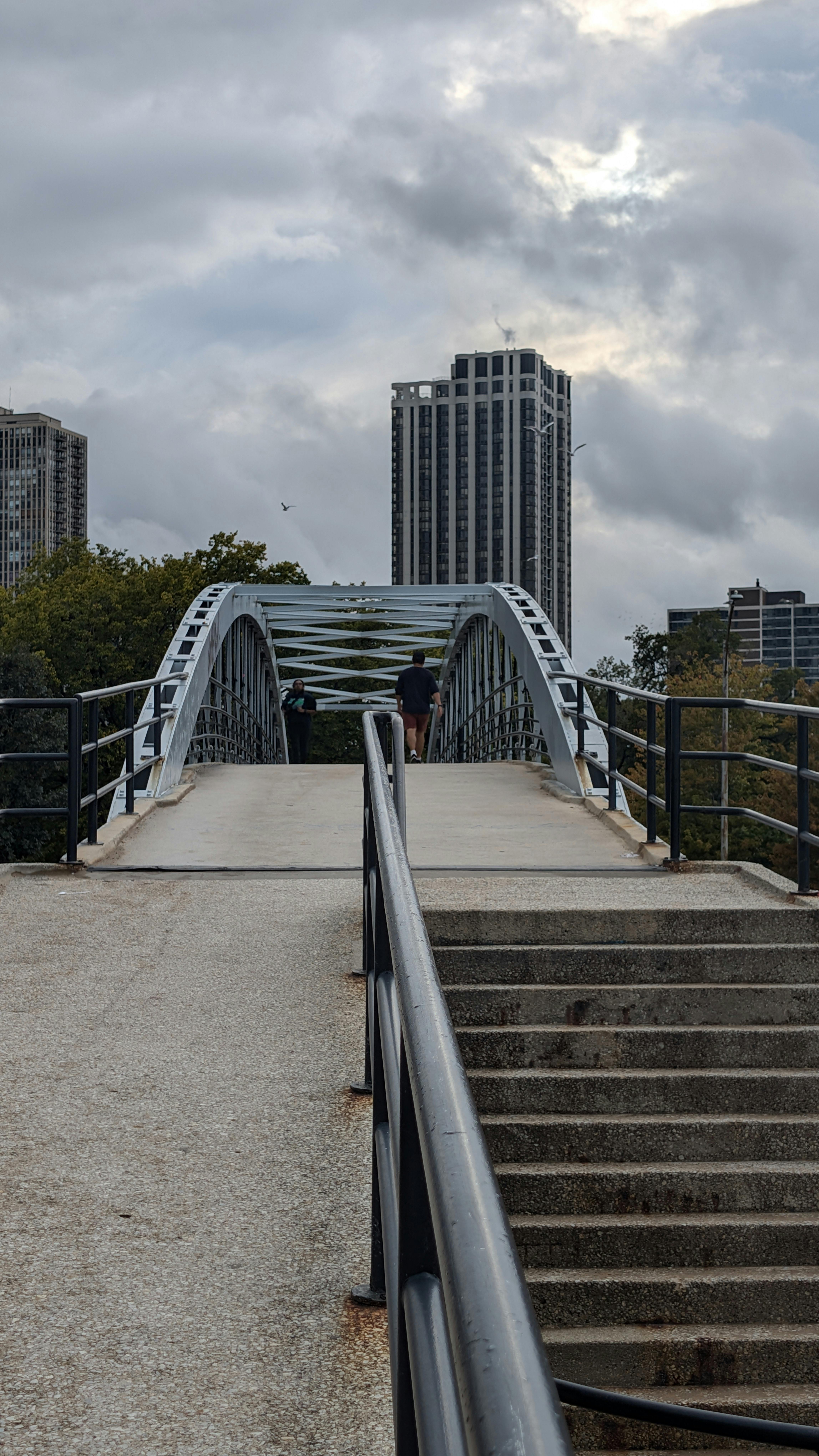 Urban Bridge Scene with Skyscrapers and Cloudy Sky · Free Stock Photo